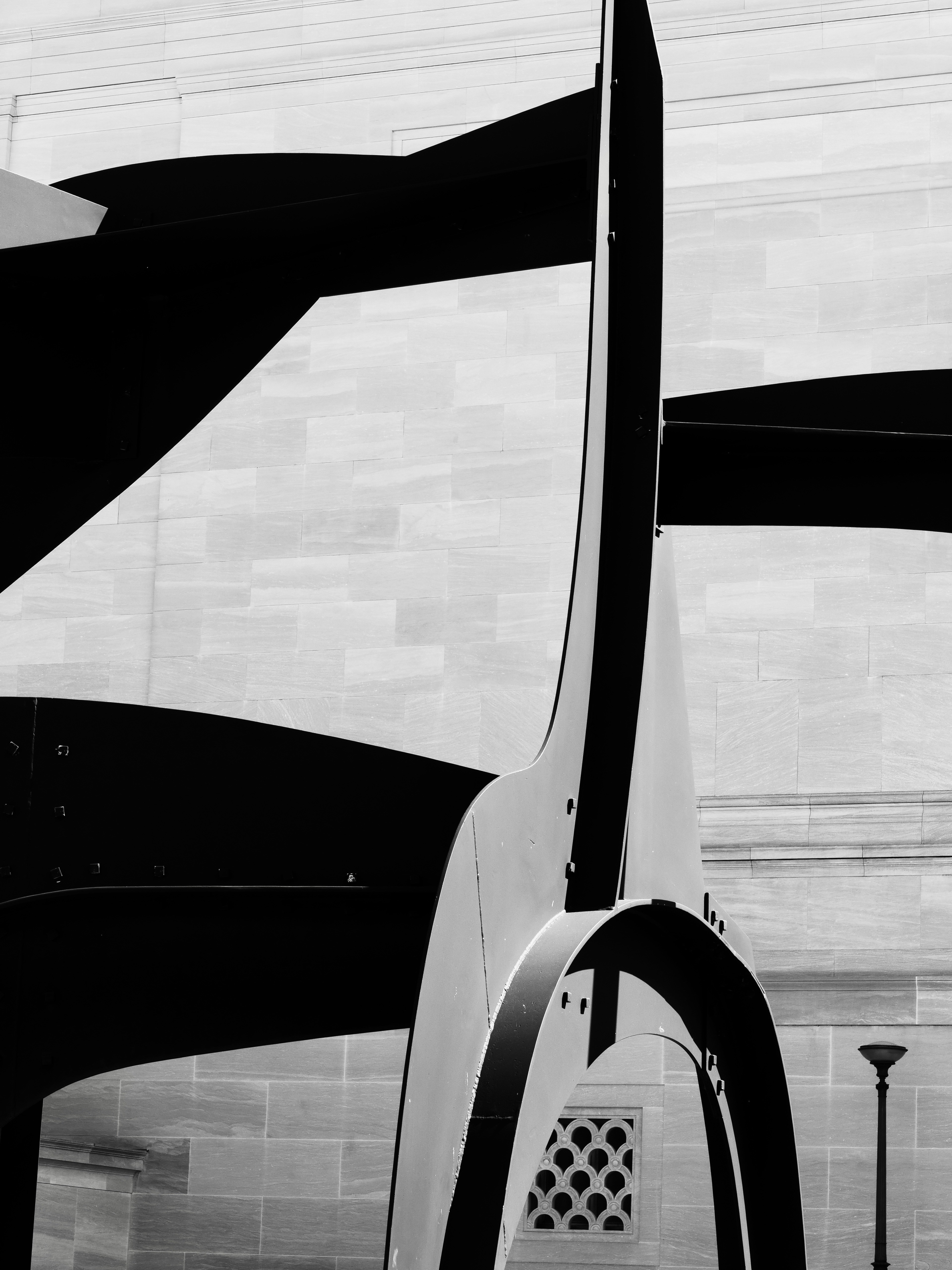 Monolithic Curves: Steel and Shadow in Black-and-White Geometry