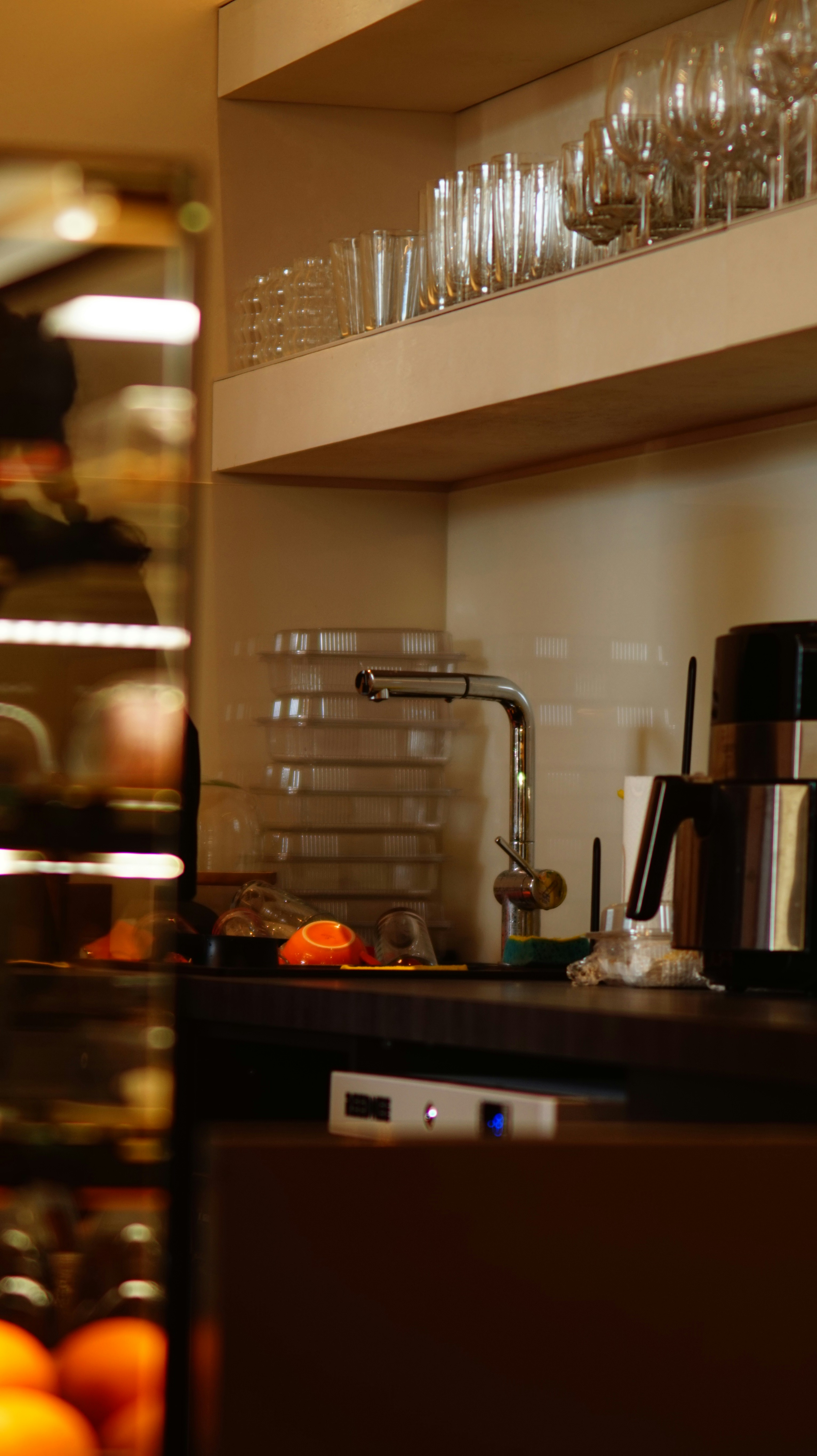 Amber-Tinted Kitchen Bar: A Quiet Corner with Glasses and Espresso Machine
