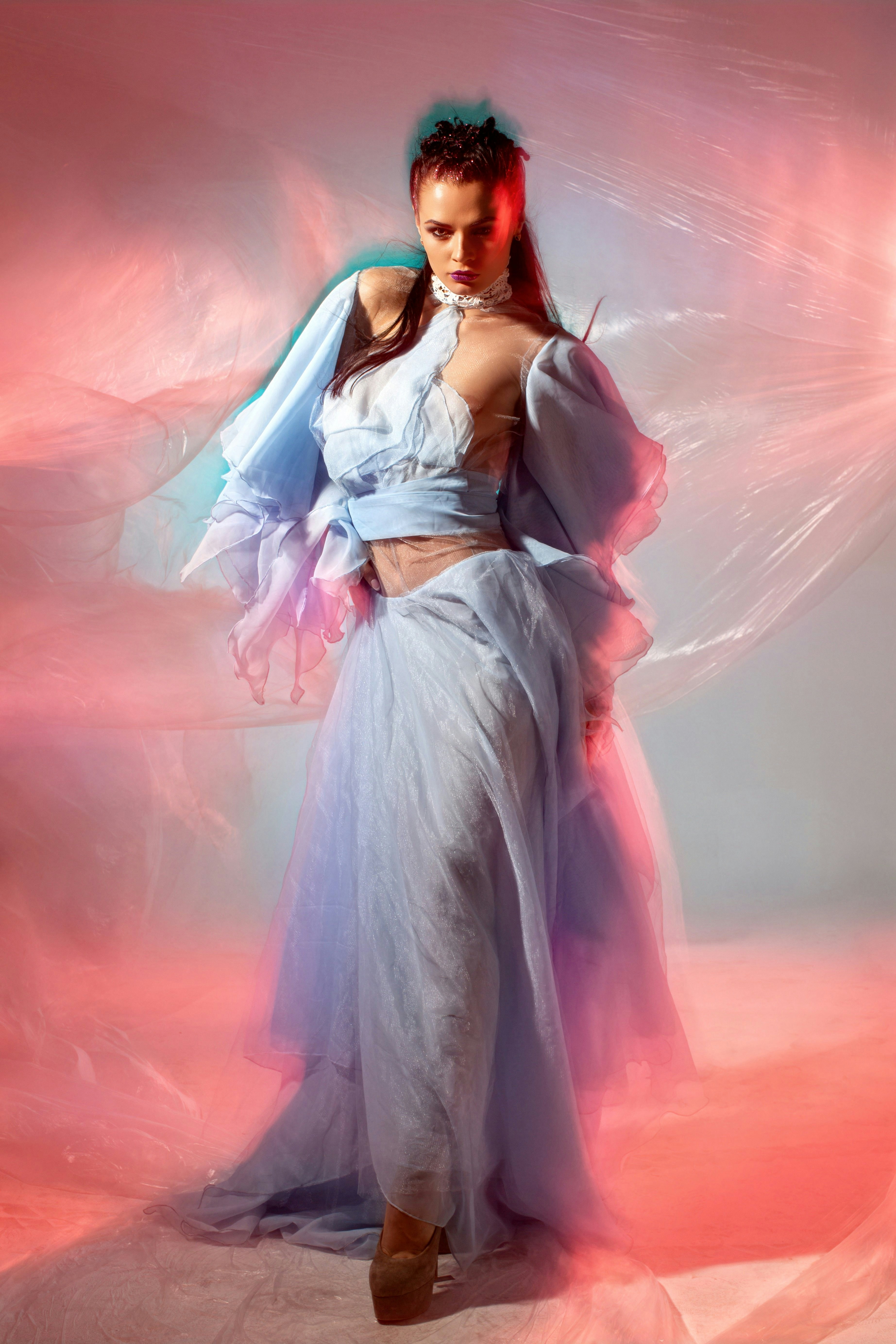 Floating silhouette: a couture moment veiled in color and motion