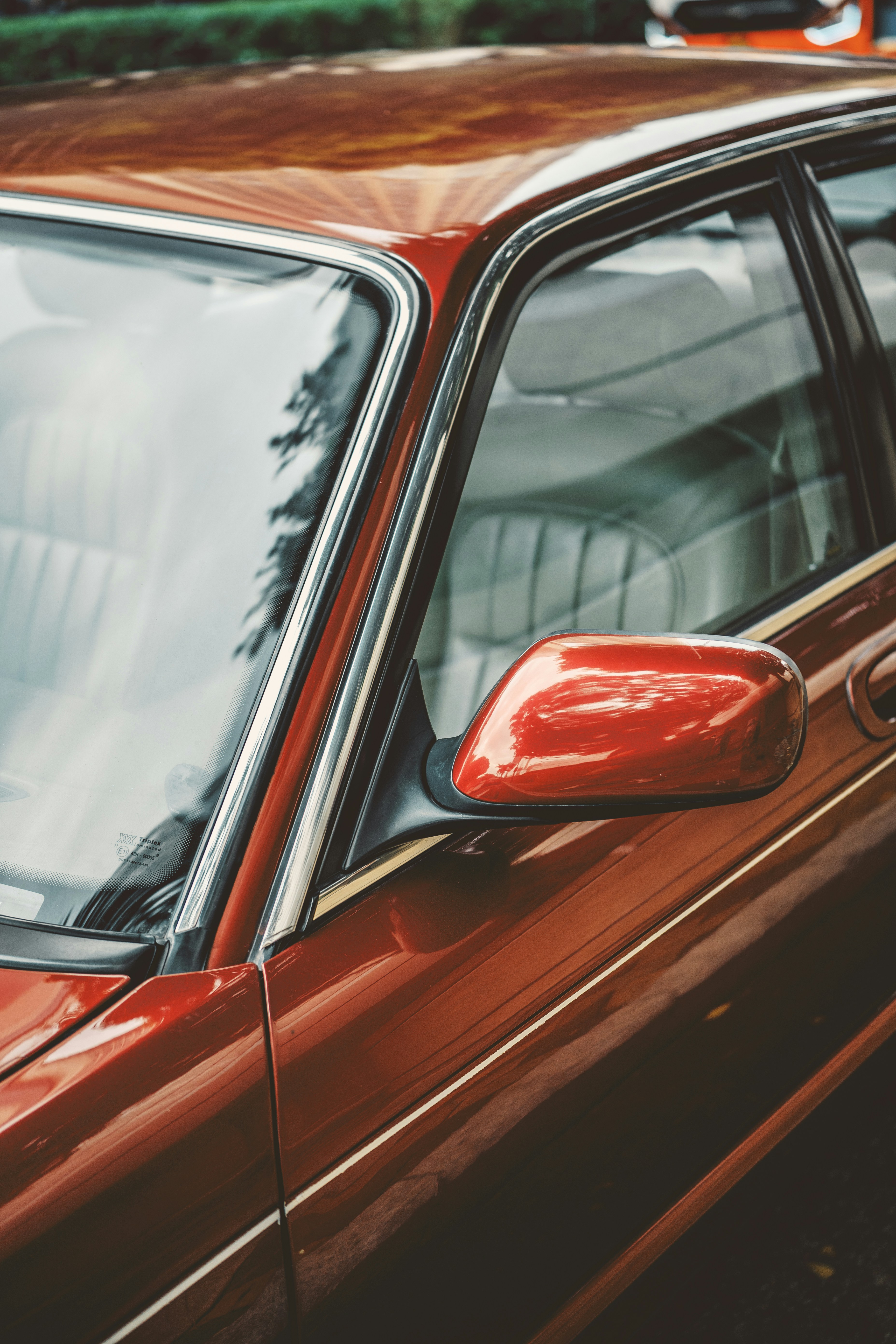 Crimson Reflection: A Classic Car Corner in Focus
