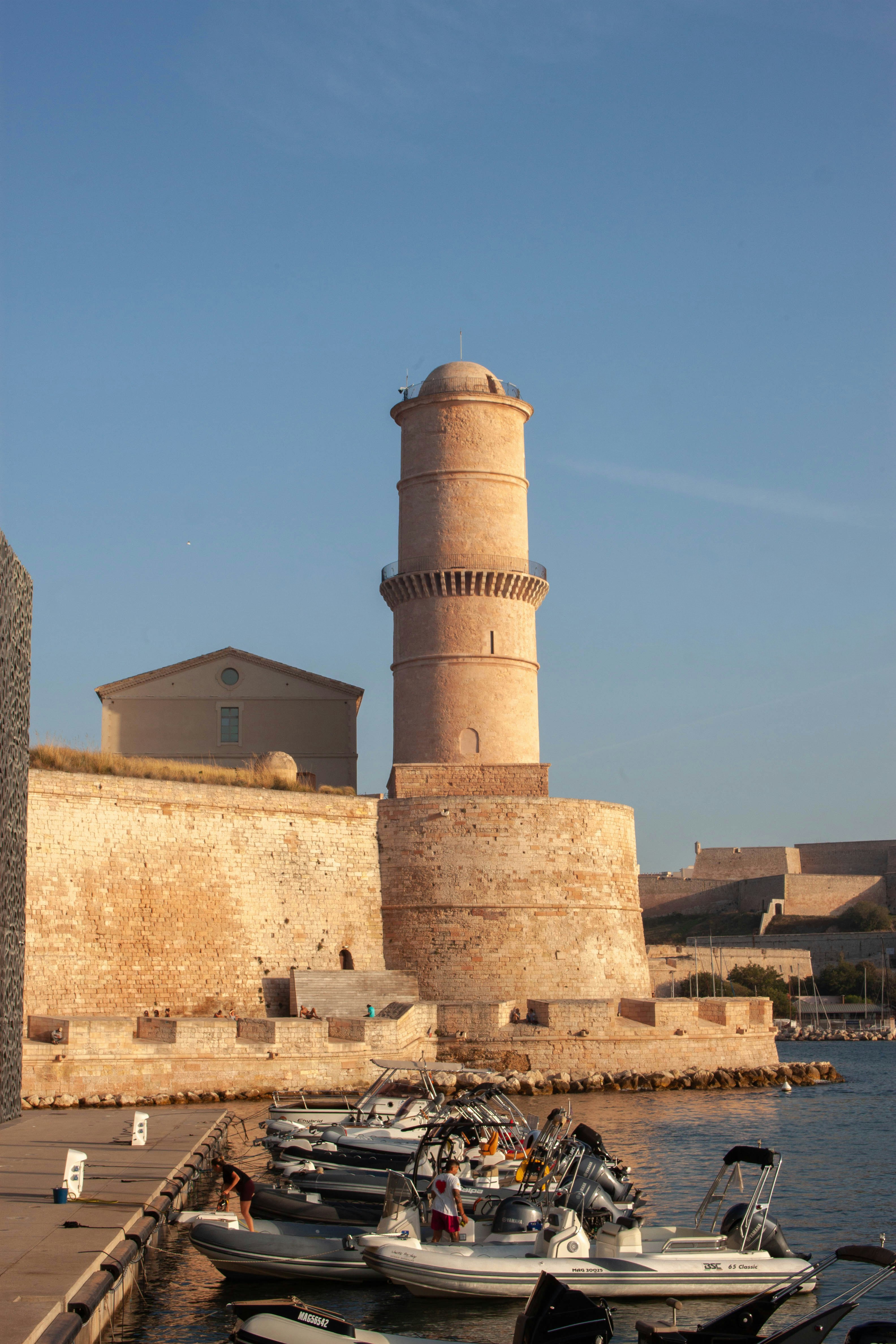 Lighthouse Guardian Overlooks the Quiet Harbor