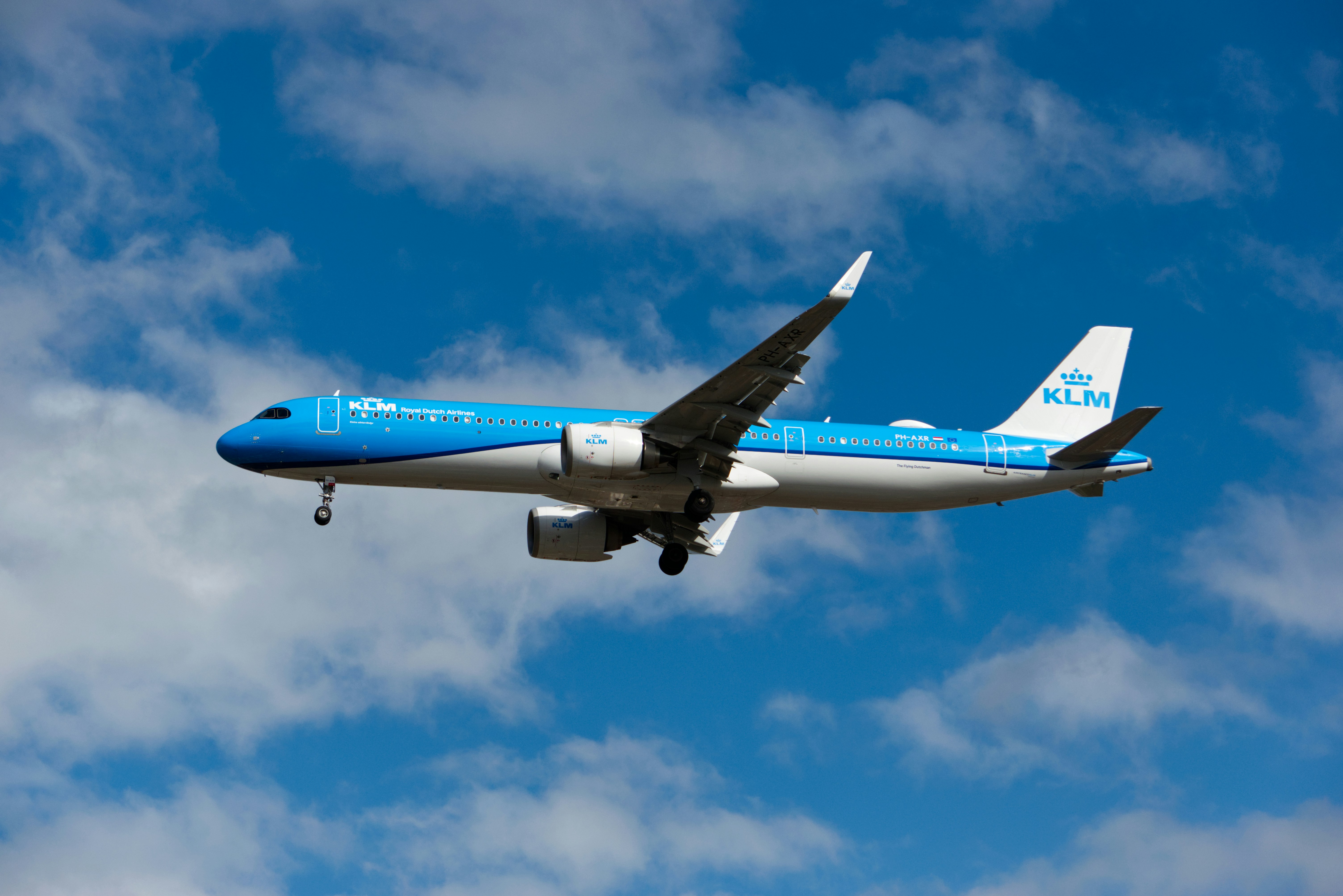 Blue KLM Jet Against a Veiled Sky