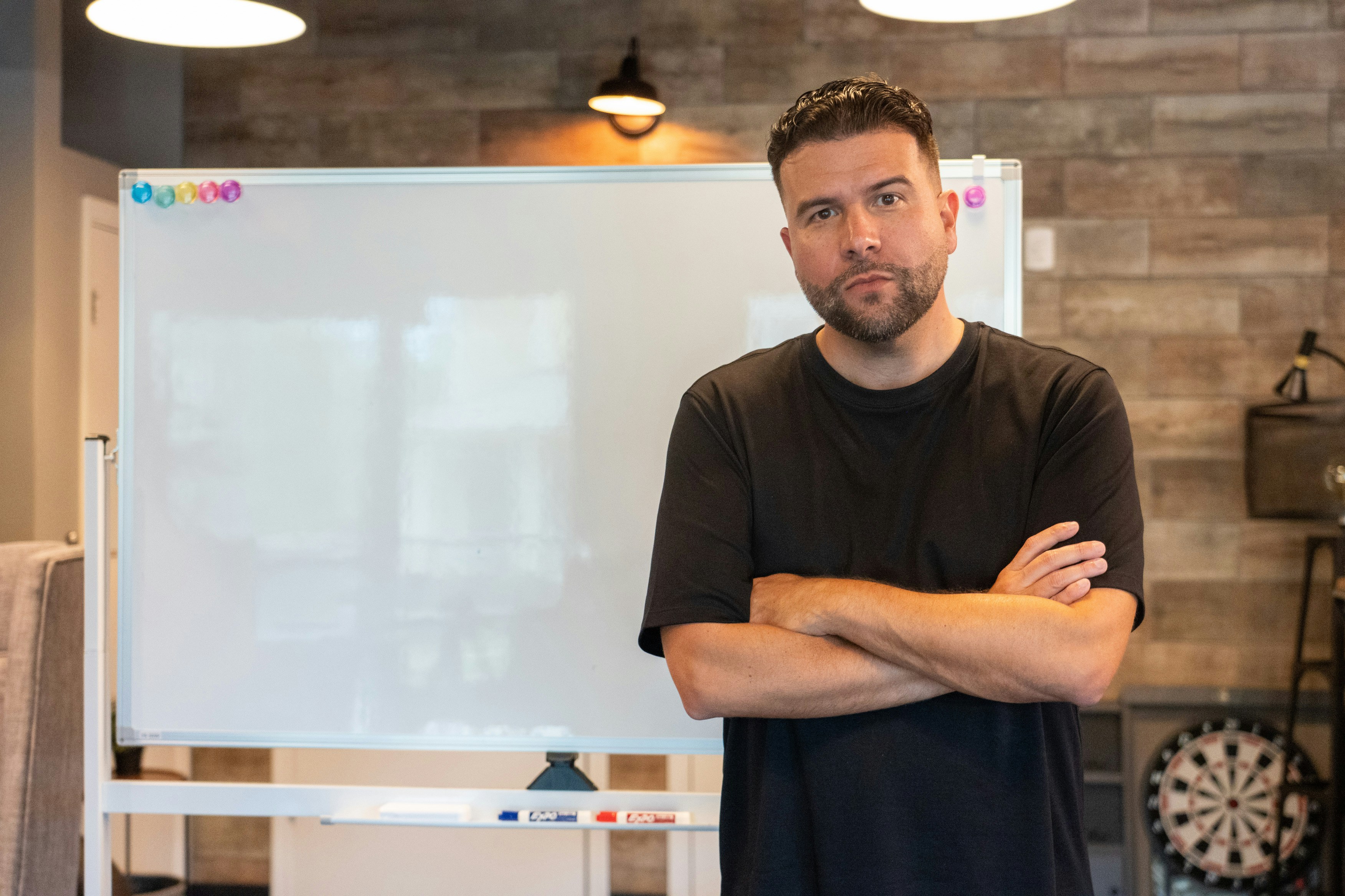 Crossed Arms, Whiteboard Backdrop: A Moment in the Office Studio