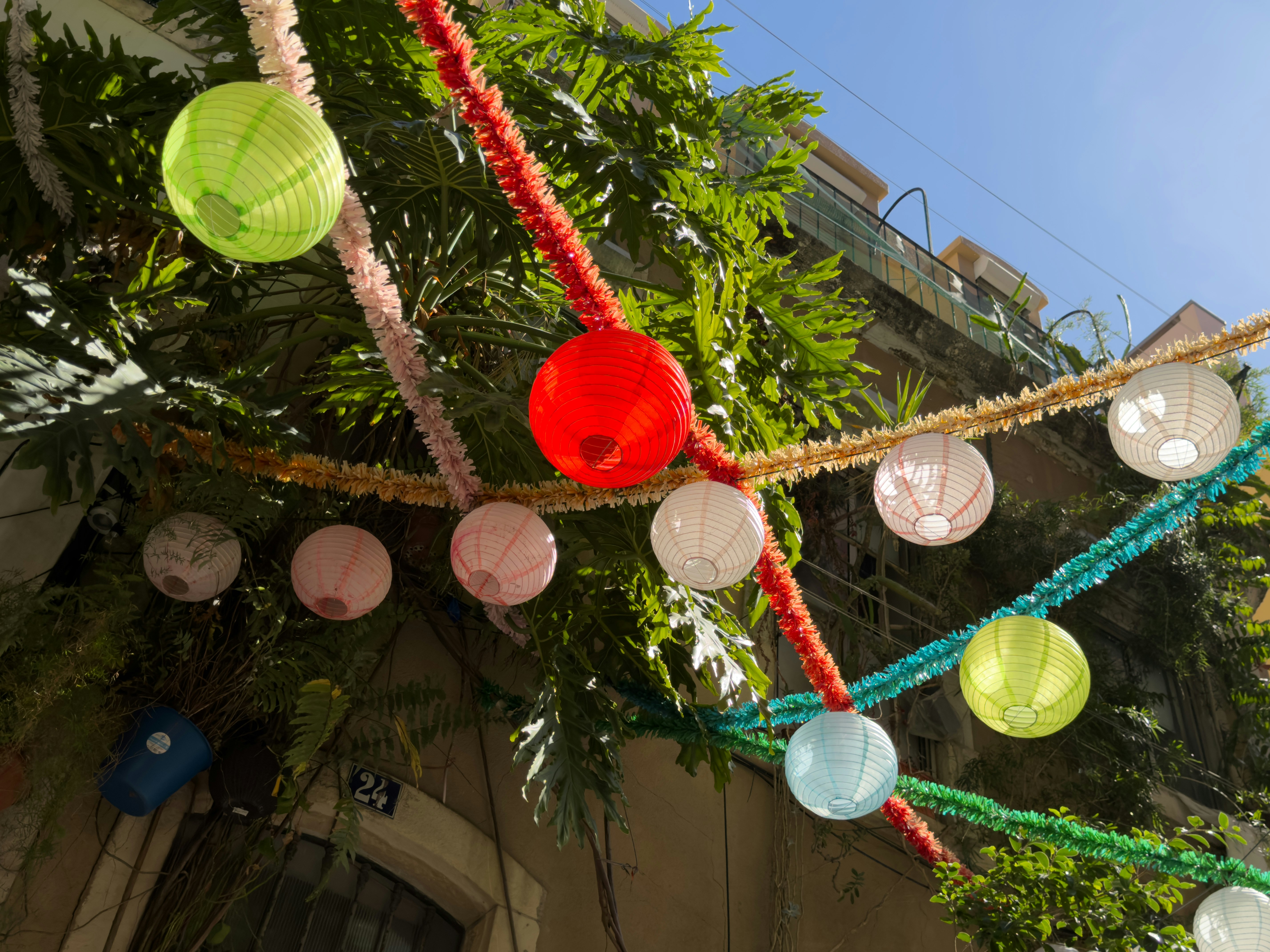 Festive Orbs in Bloom: Street Lanterns Under a Clear Sky