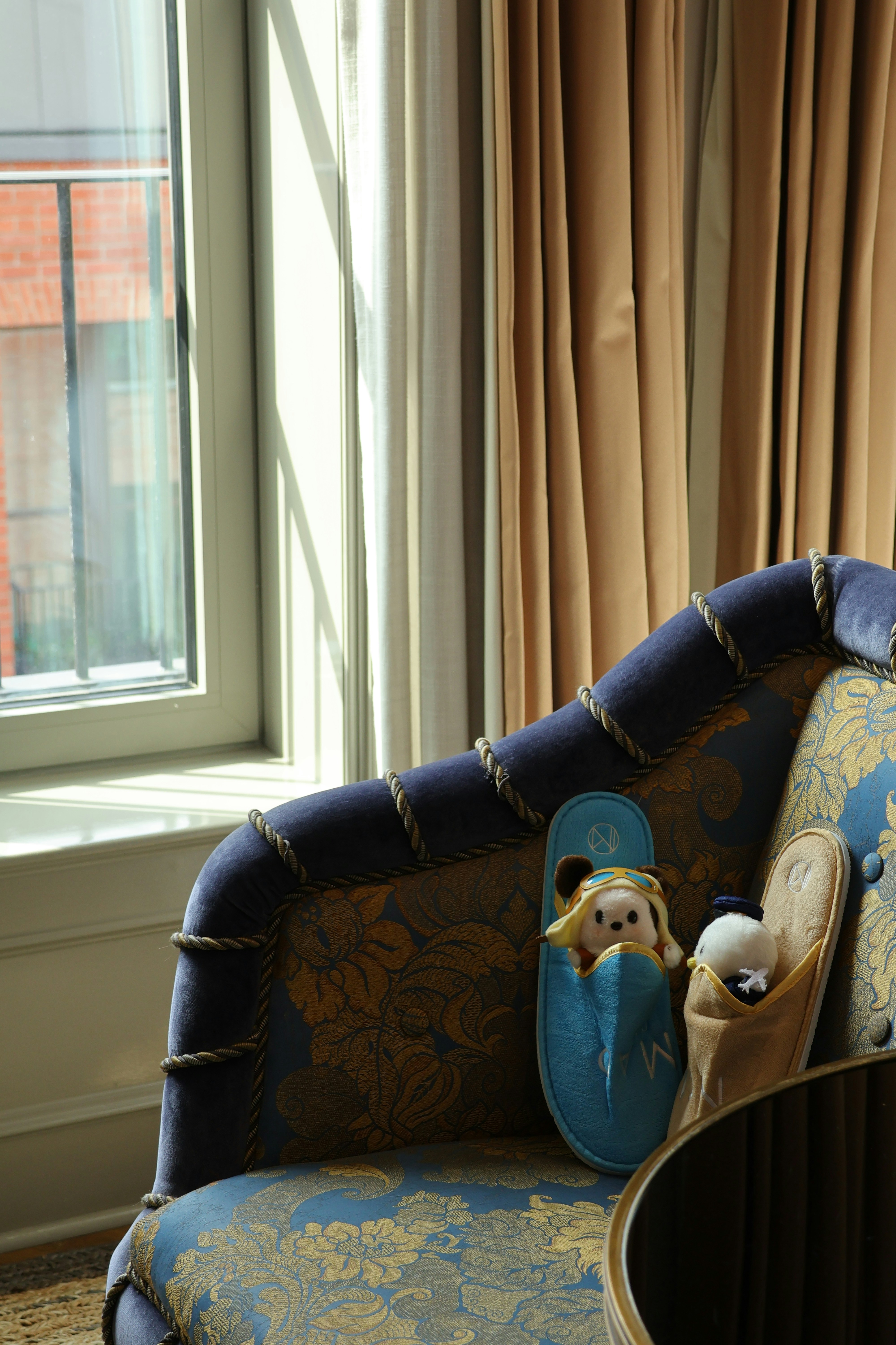 Sunlit Lounge: Plush Doll Nook on an Ornate Couch by the Window