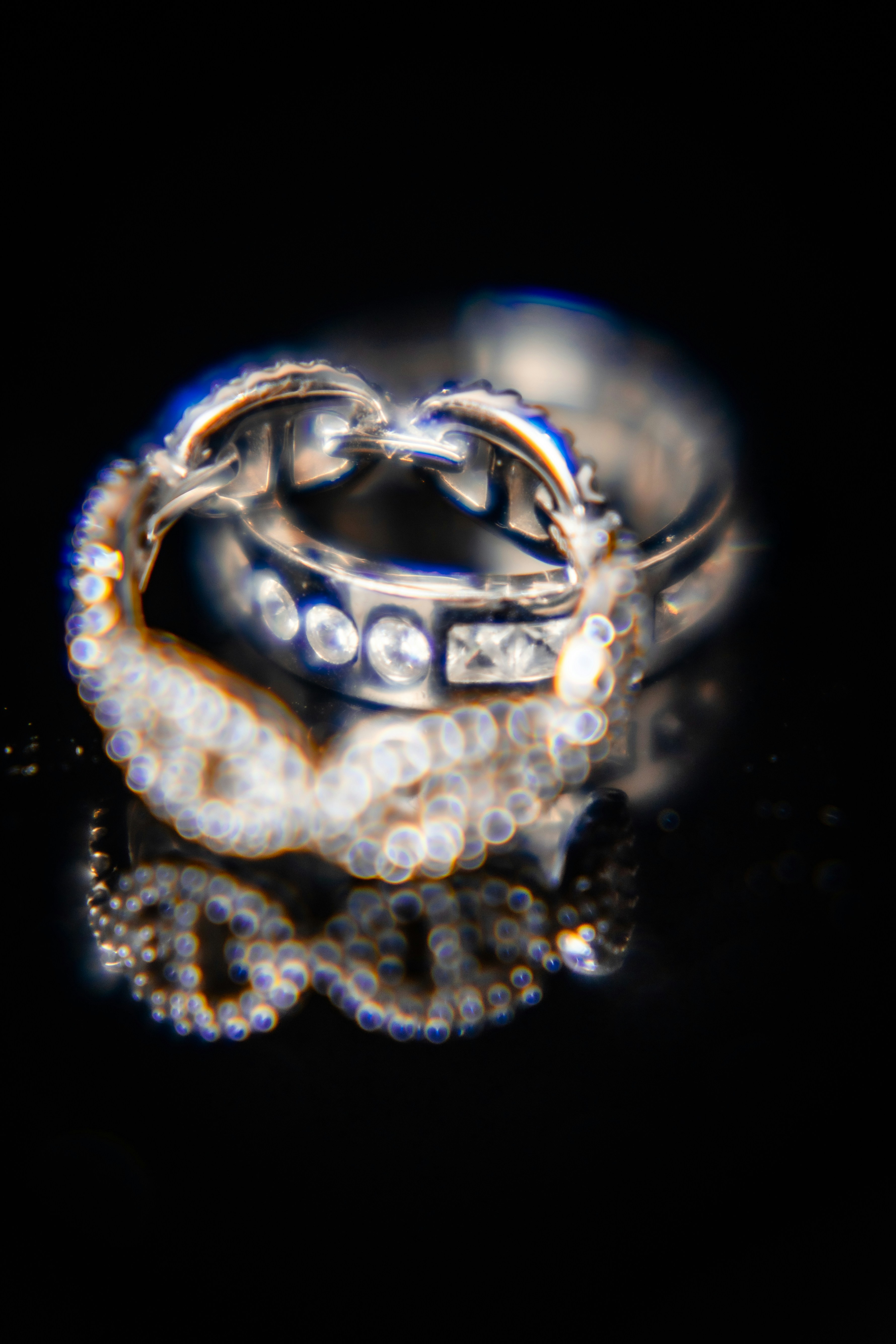 Ringed Reflections: A Close-Up of Shimmering Jewelry in Blur