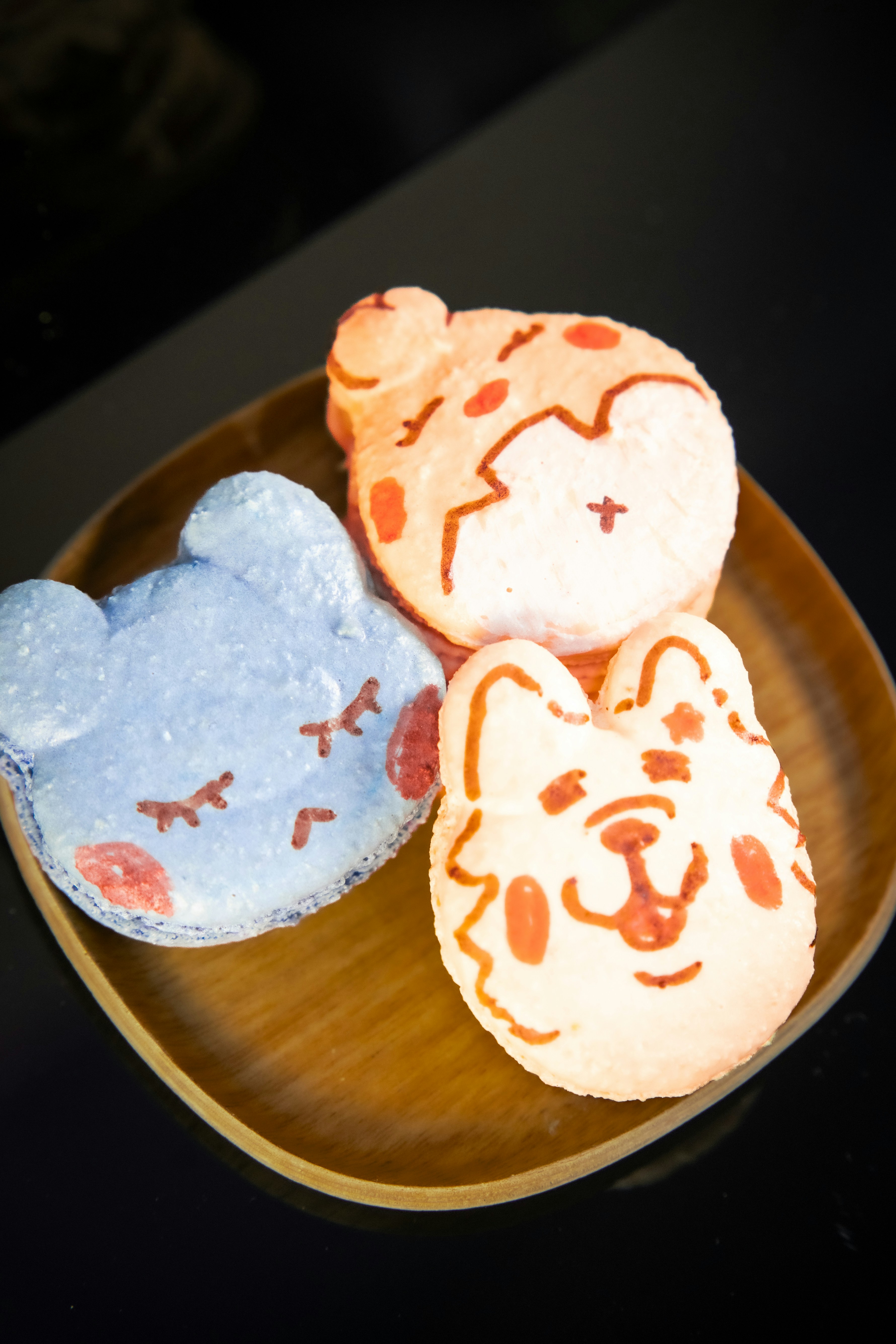 Three Sweet Faces on a Wooden Plate: Sugar-Cloud Llamas and Friends