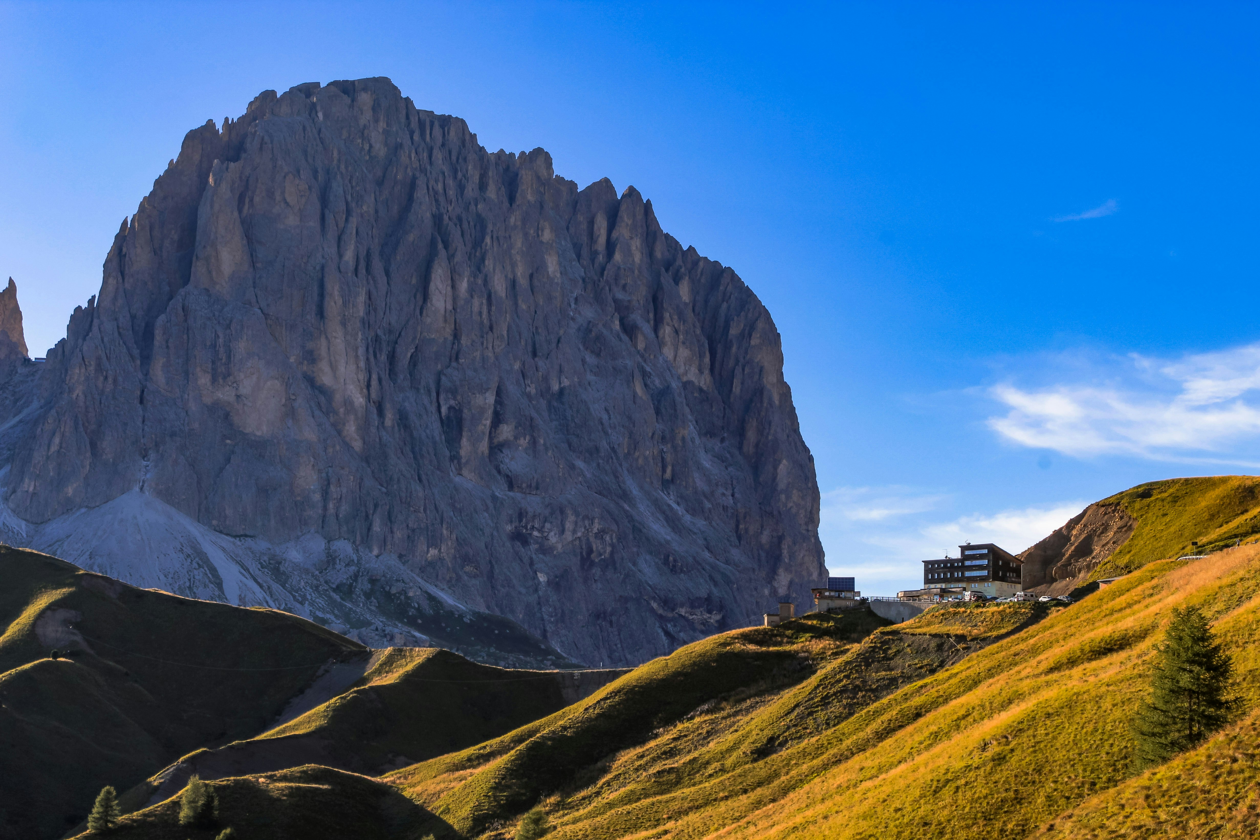 Stony Summit: A Lone Lodge Watches Over Golden Hills