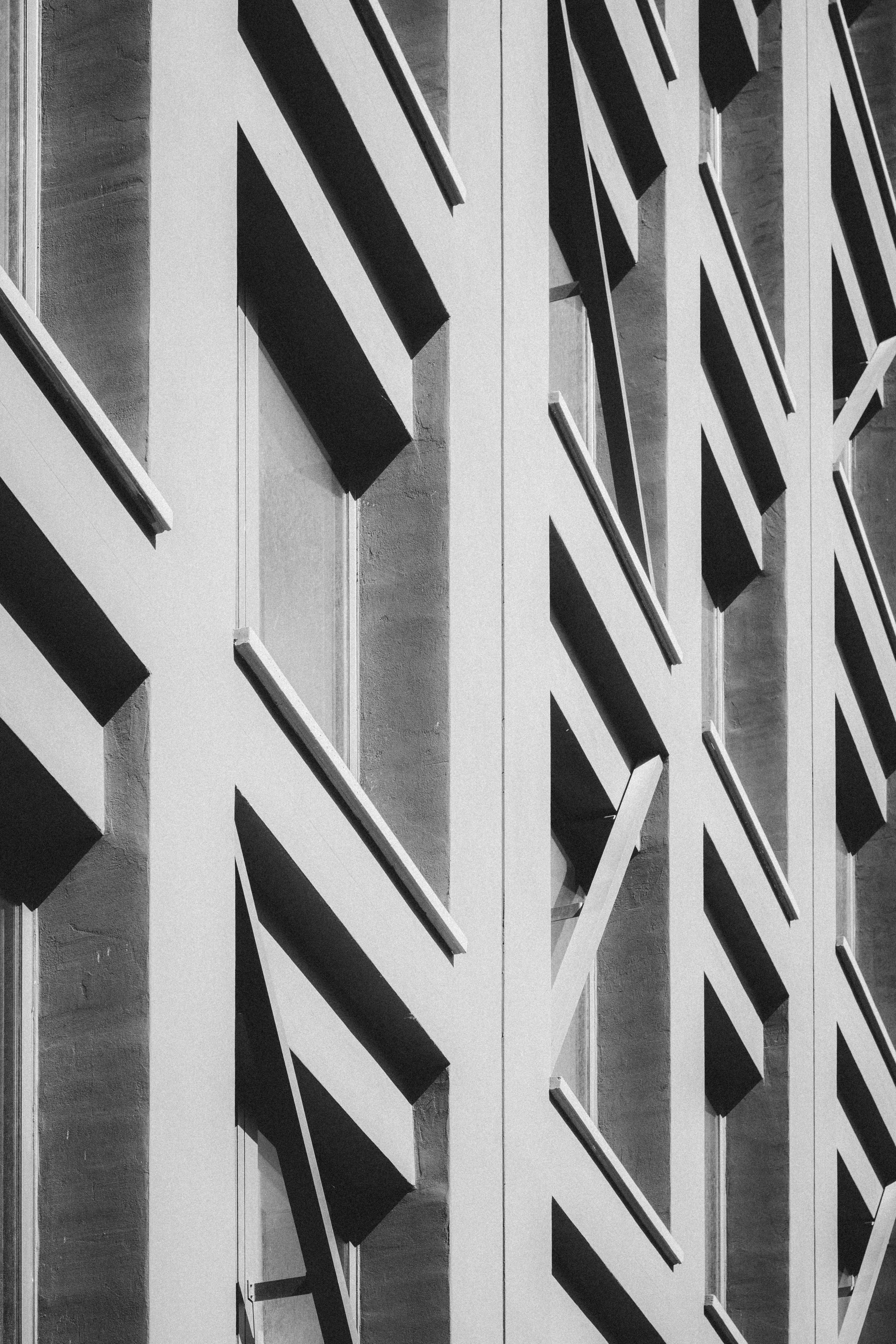 Geometric Facade Echoes: A Tesselated Play of Light and Shadow
