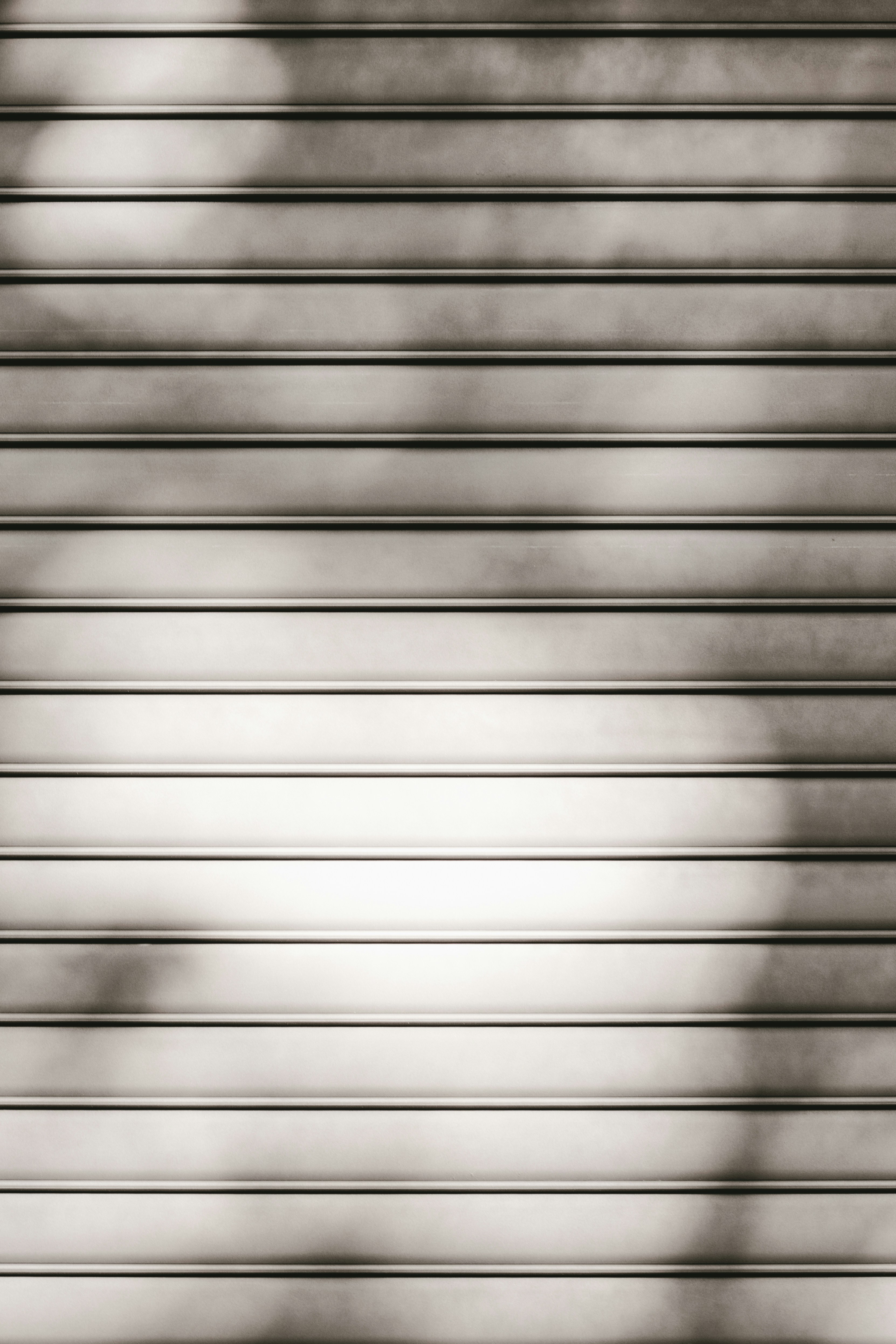 Shadowed Lines: A Quiet Gradient of Metal Troughs