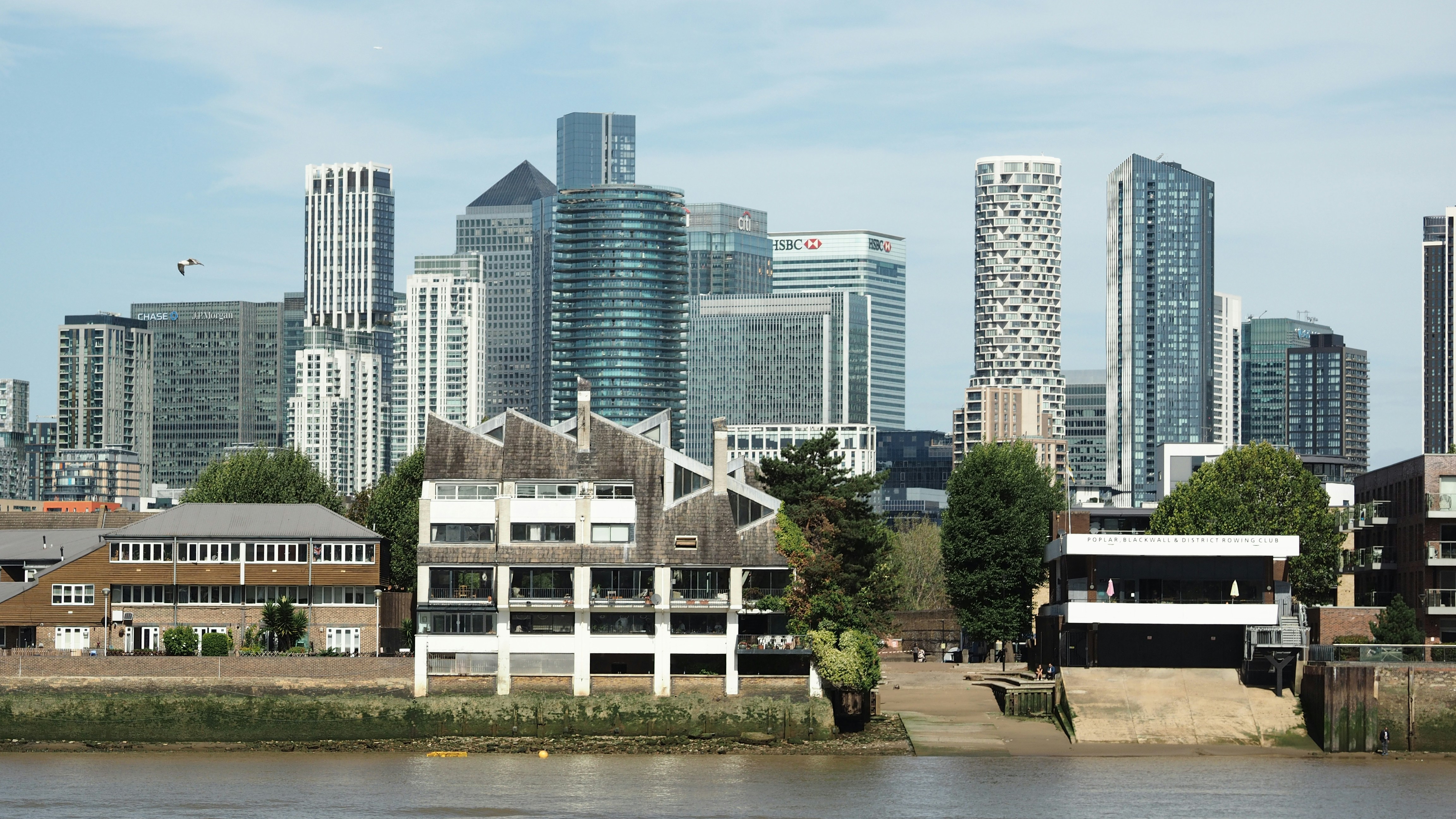 Cityscape Reflections: Riverside Ground-Level to Skyline Elevation