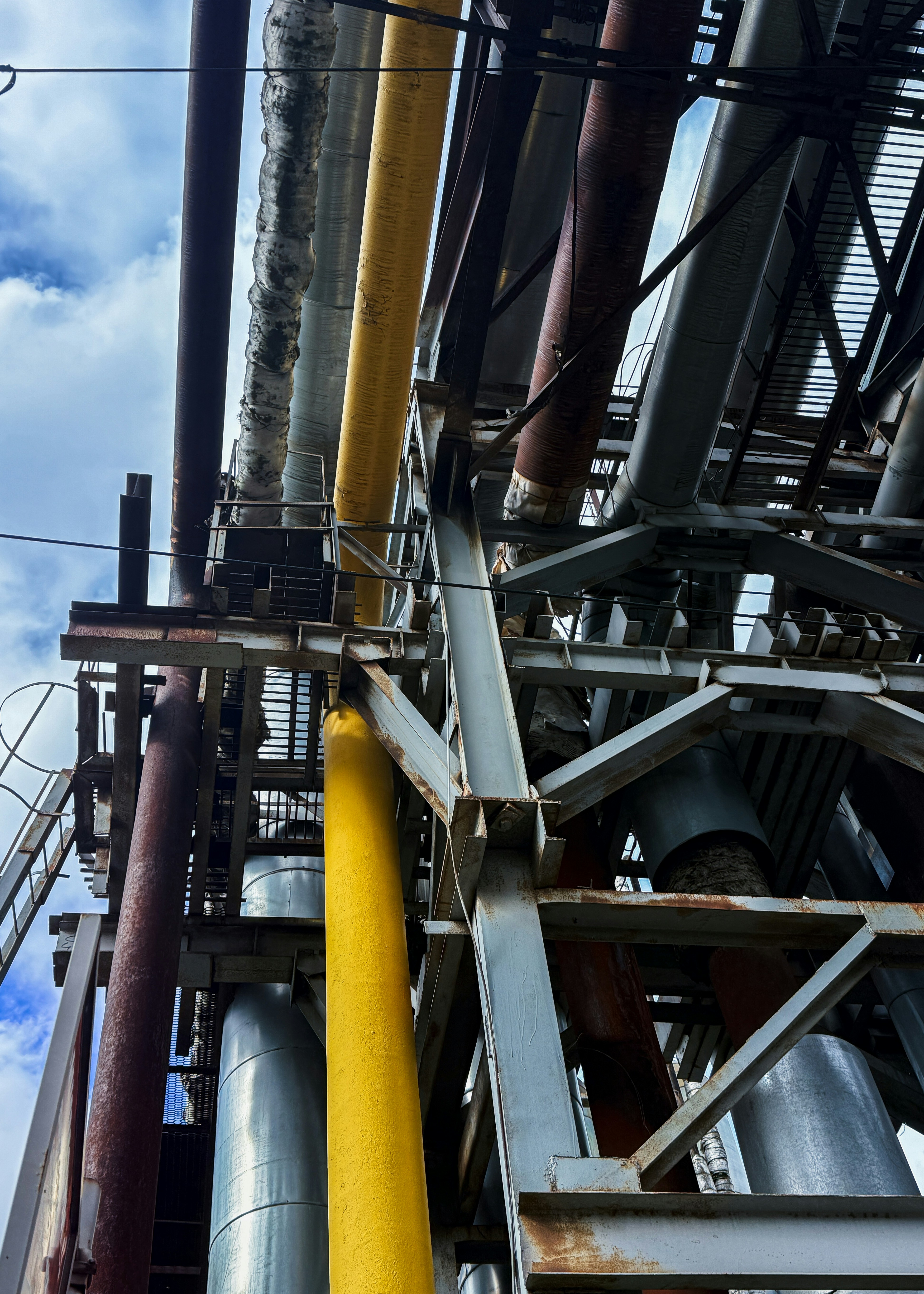 Industrial Skyline: A Dense Matrix of Pipes and Rails