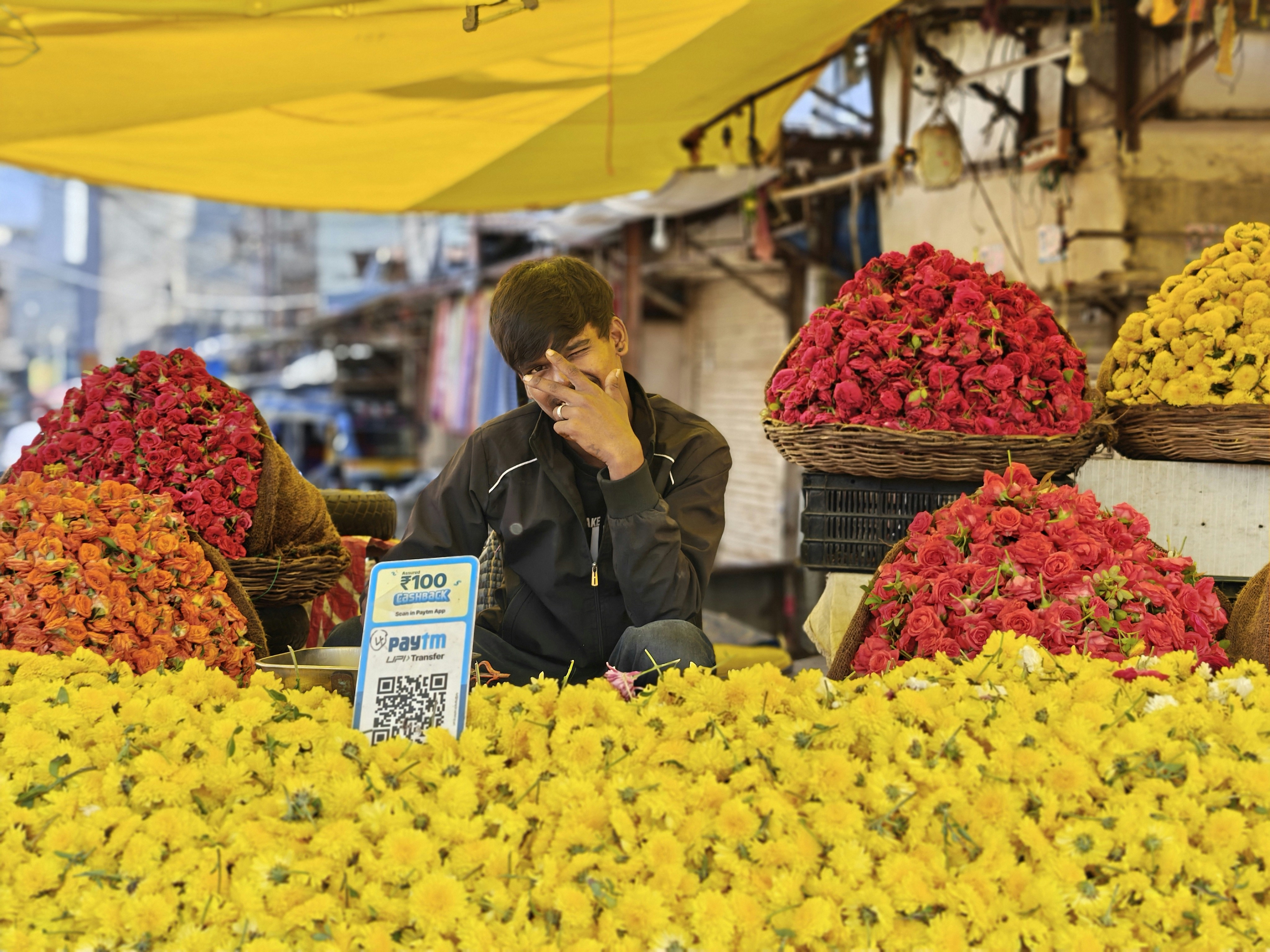 Market Bloom: A Flower Vendor in a Sunlit Alley