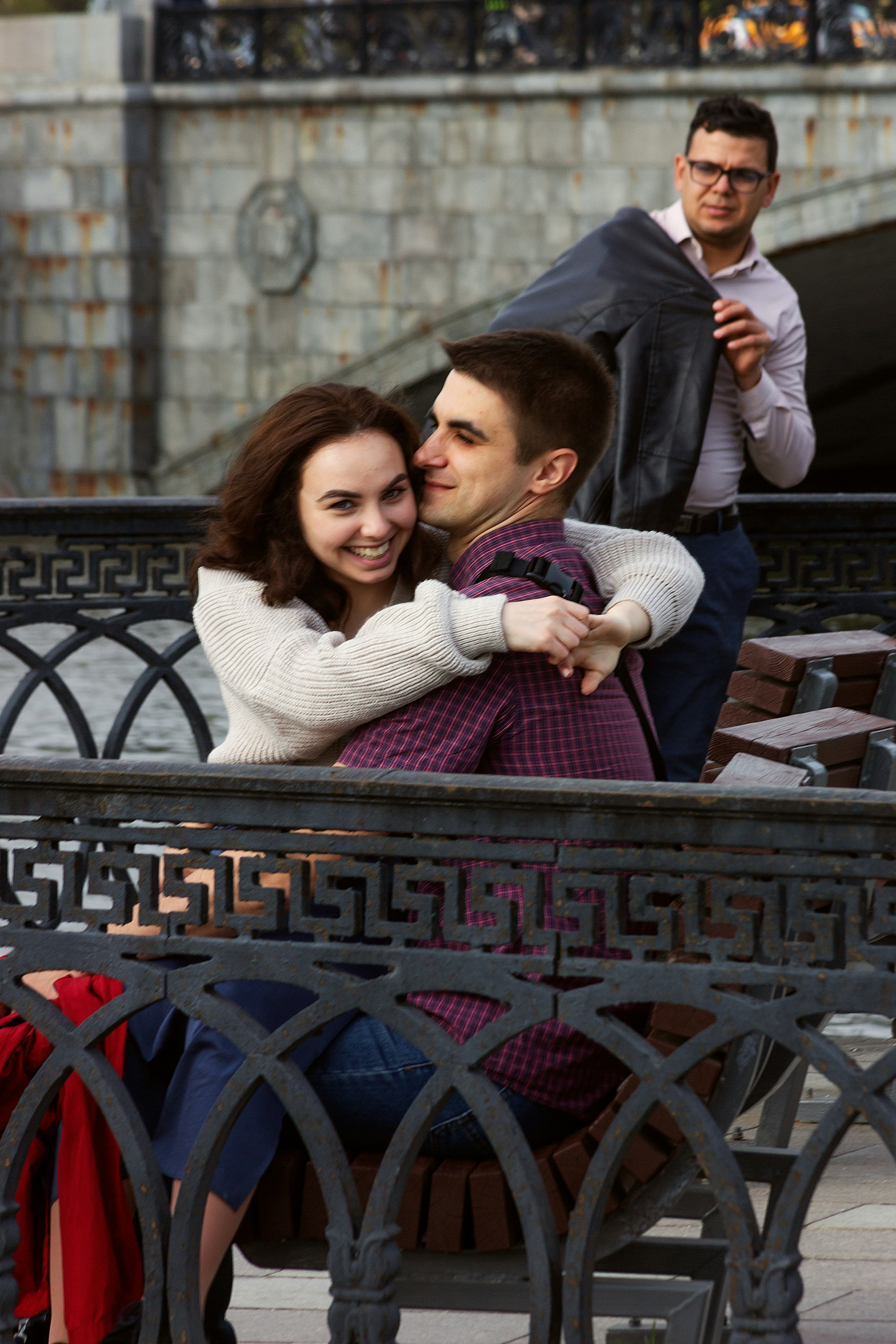 Embrace on the Riverbank: A Moment of Gentle Affection