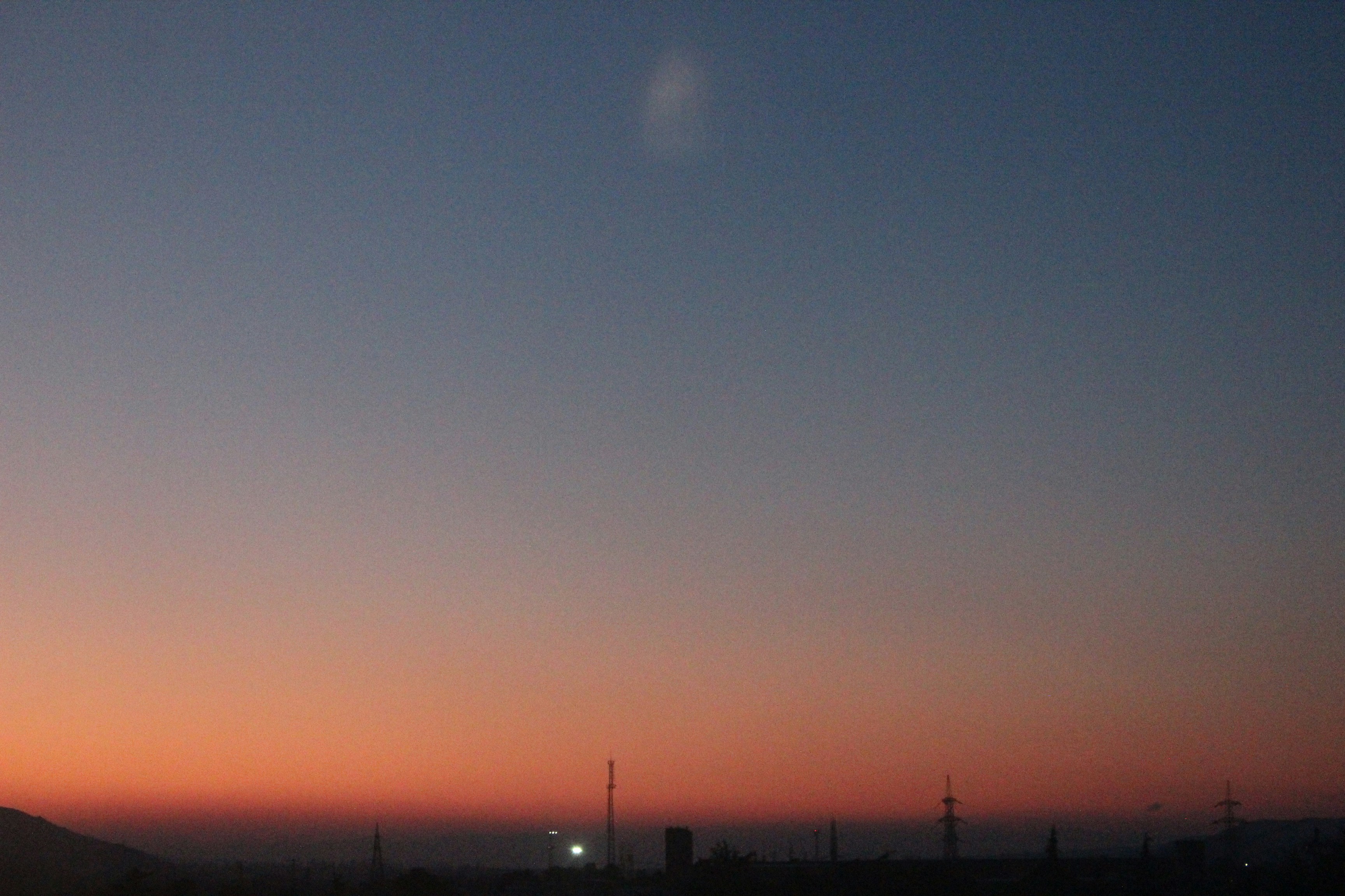 Dusk Horizon: Silent City Silhouettes Beneath a Fading Sky