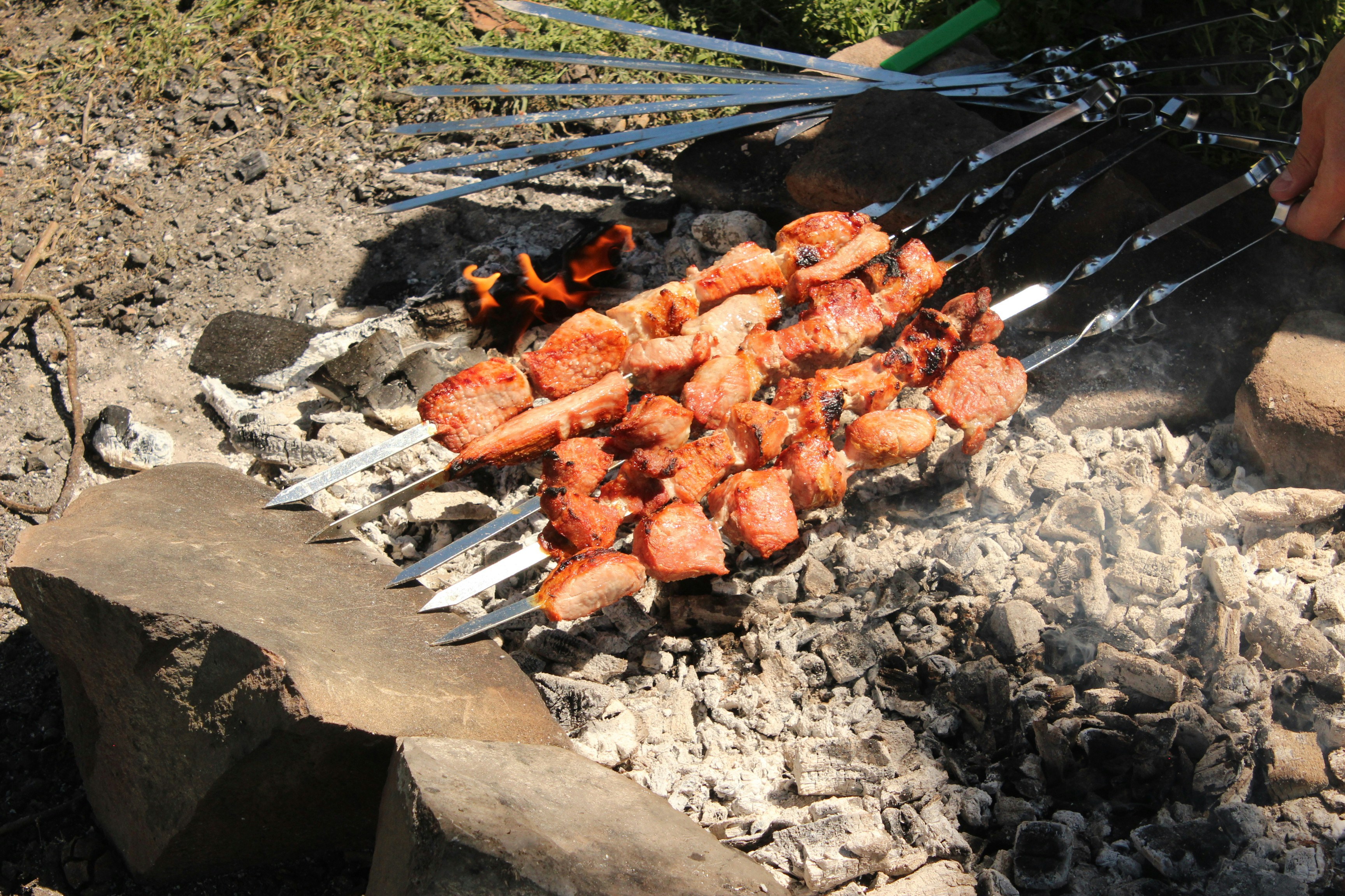 Sizzling Skewers Over a Creekside Ember