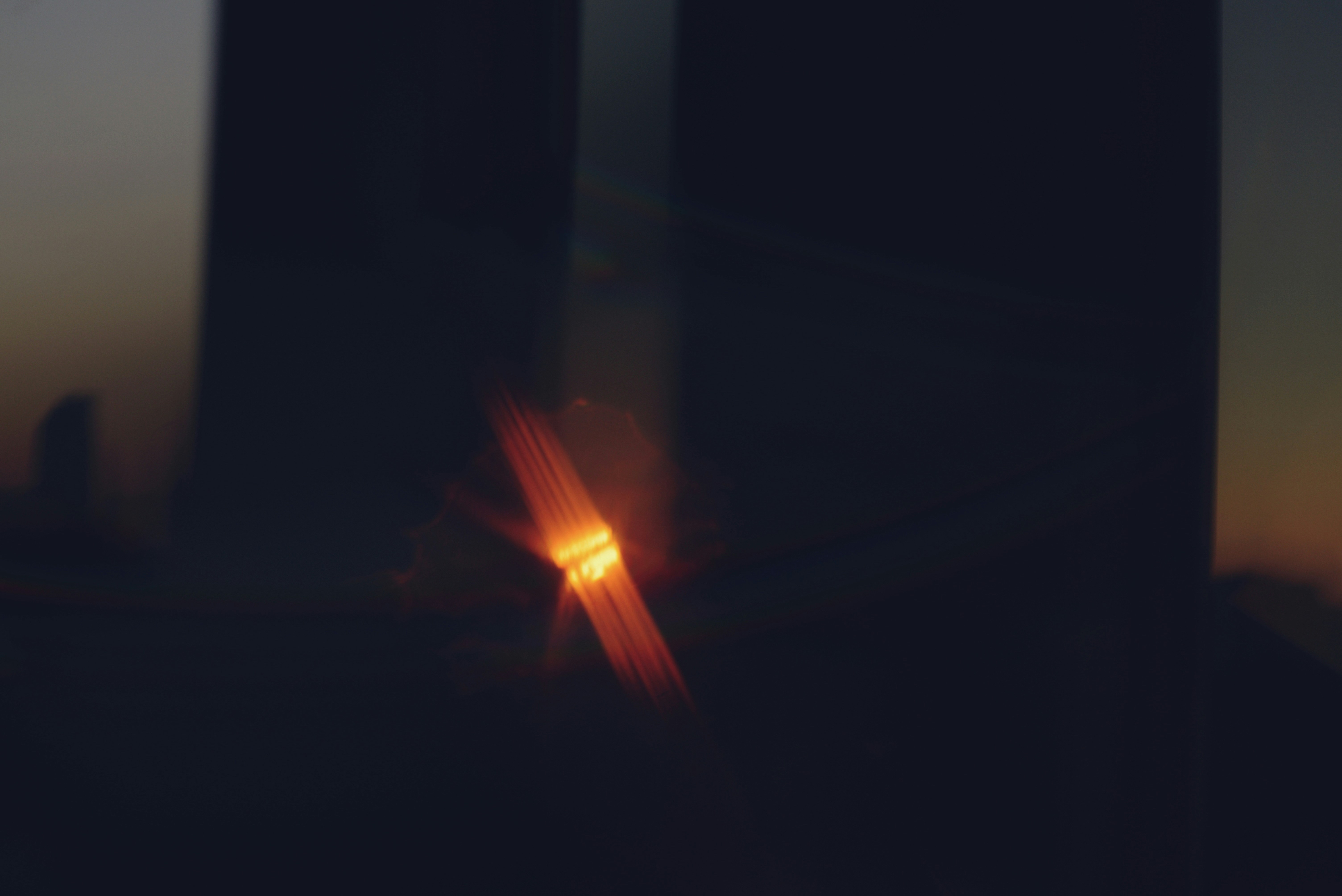 Glint Through Twilight: A Quiet Corner of Fire and Shadow