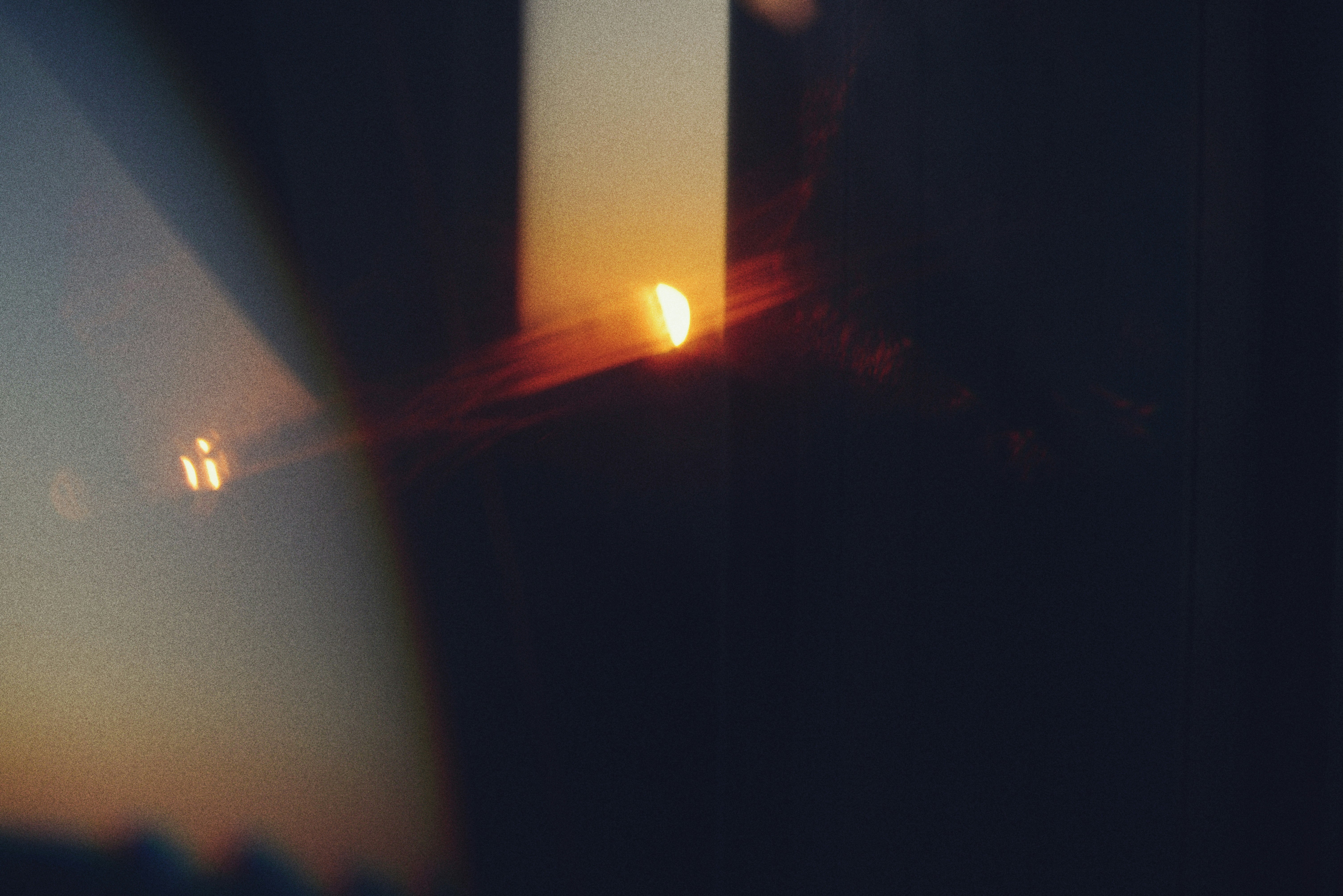 Mid-Row Sunflare Through Glass: A Quiet Sunset Glow