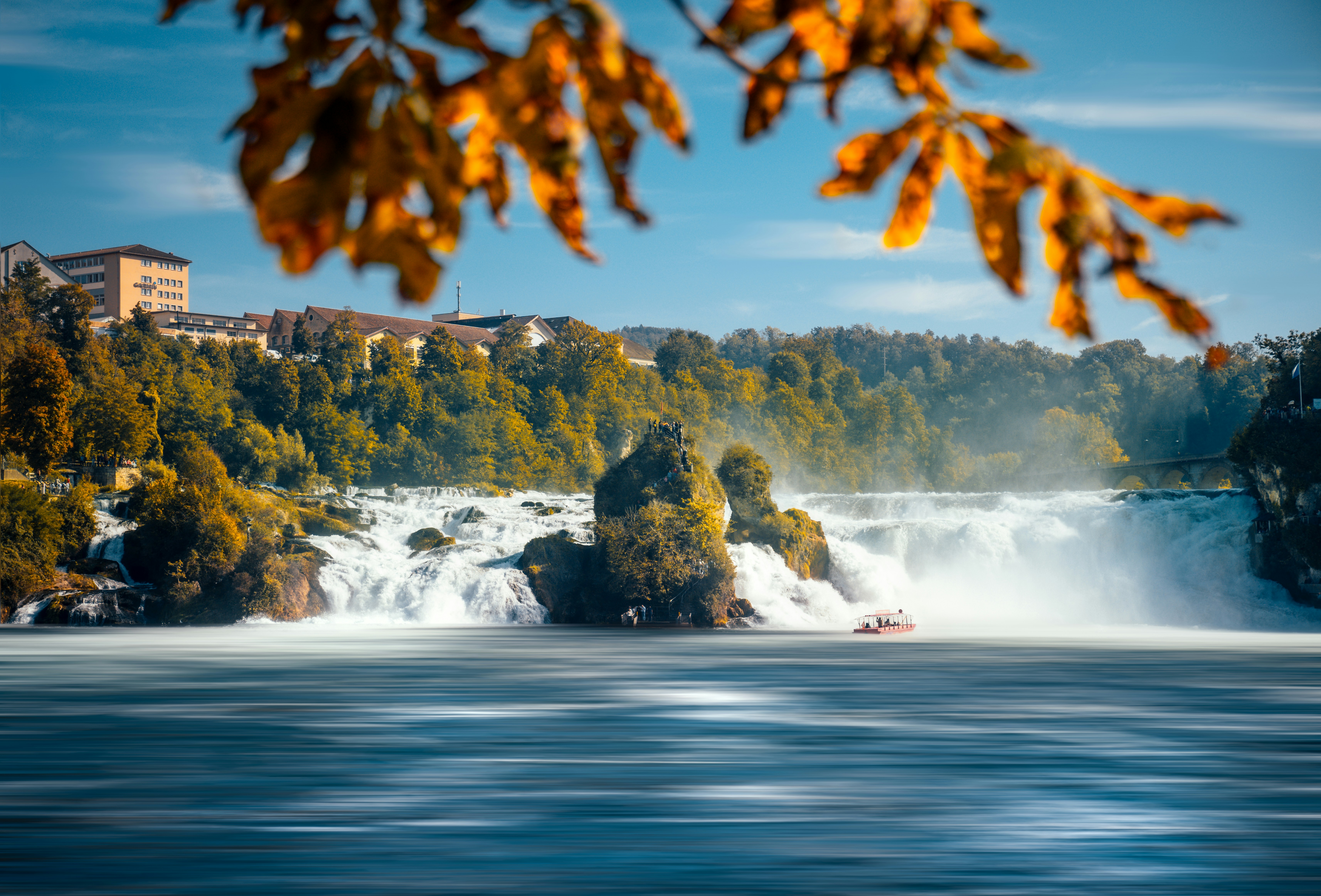 Autumn Mist at the Falls: A River Framed by Golden Leaves