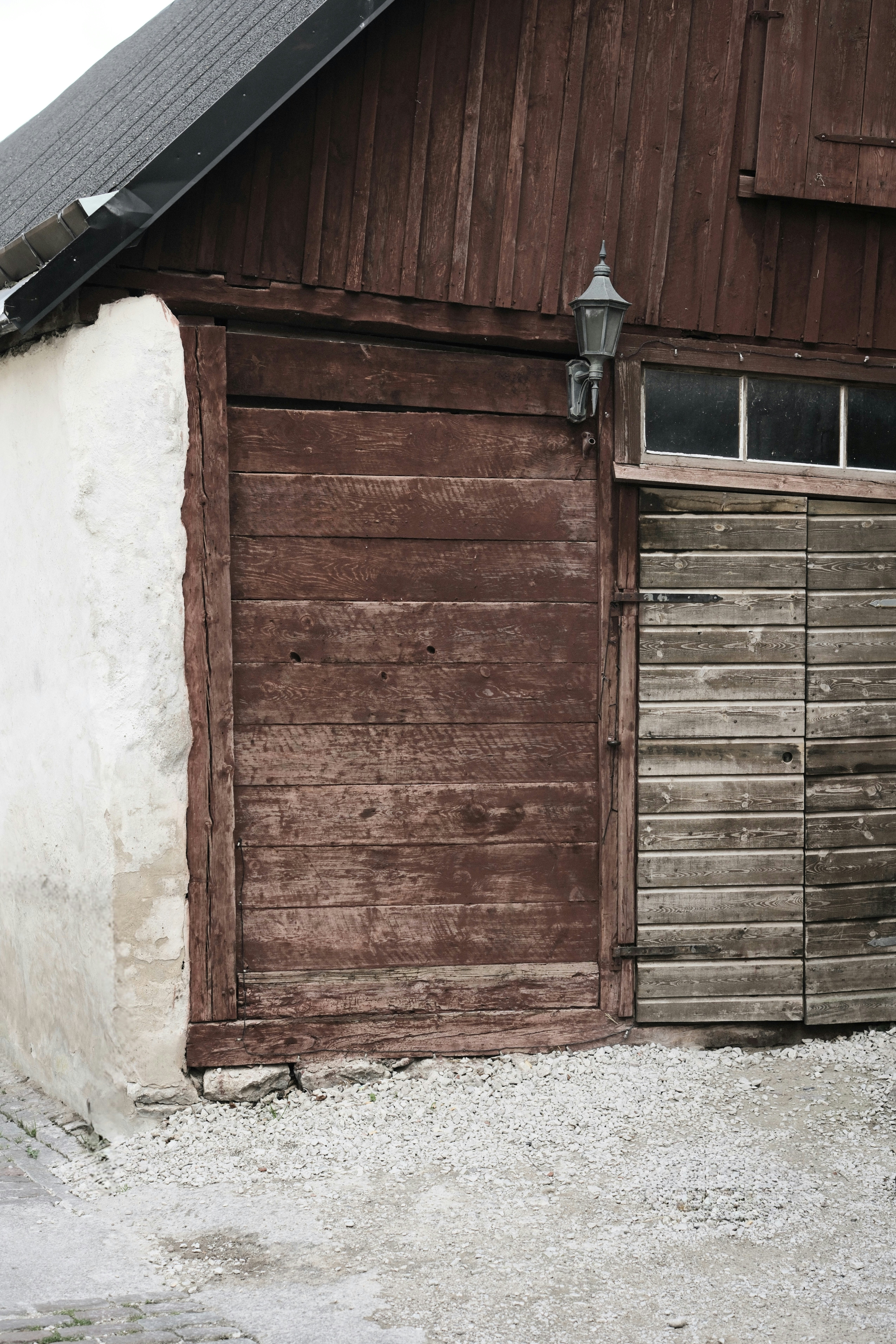 Weathered Red Wood Doorframe under an Old Lantern