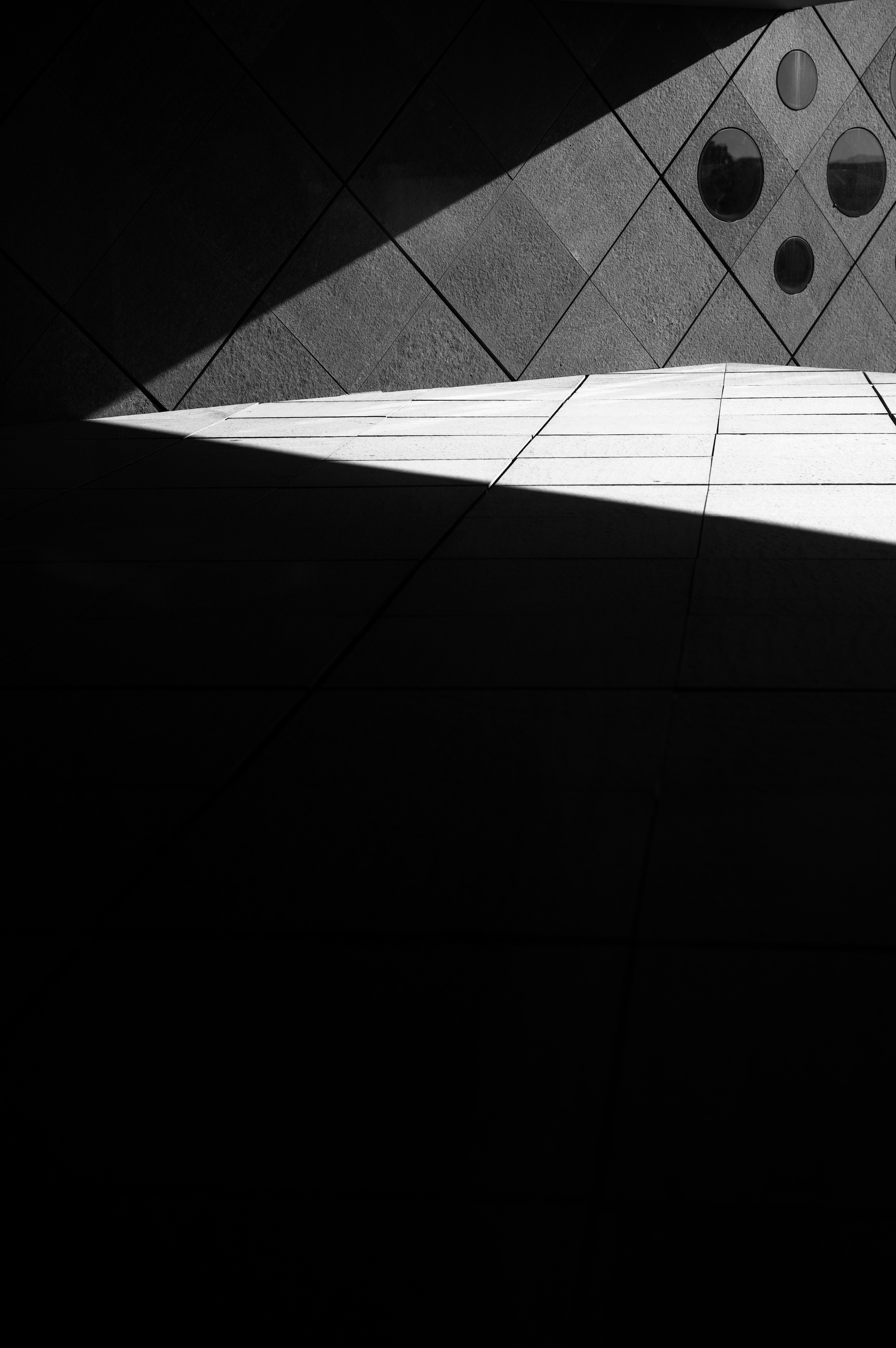 Shadowed Geometry: A Play of Light on Faceted Tiles