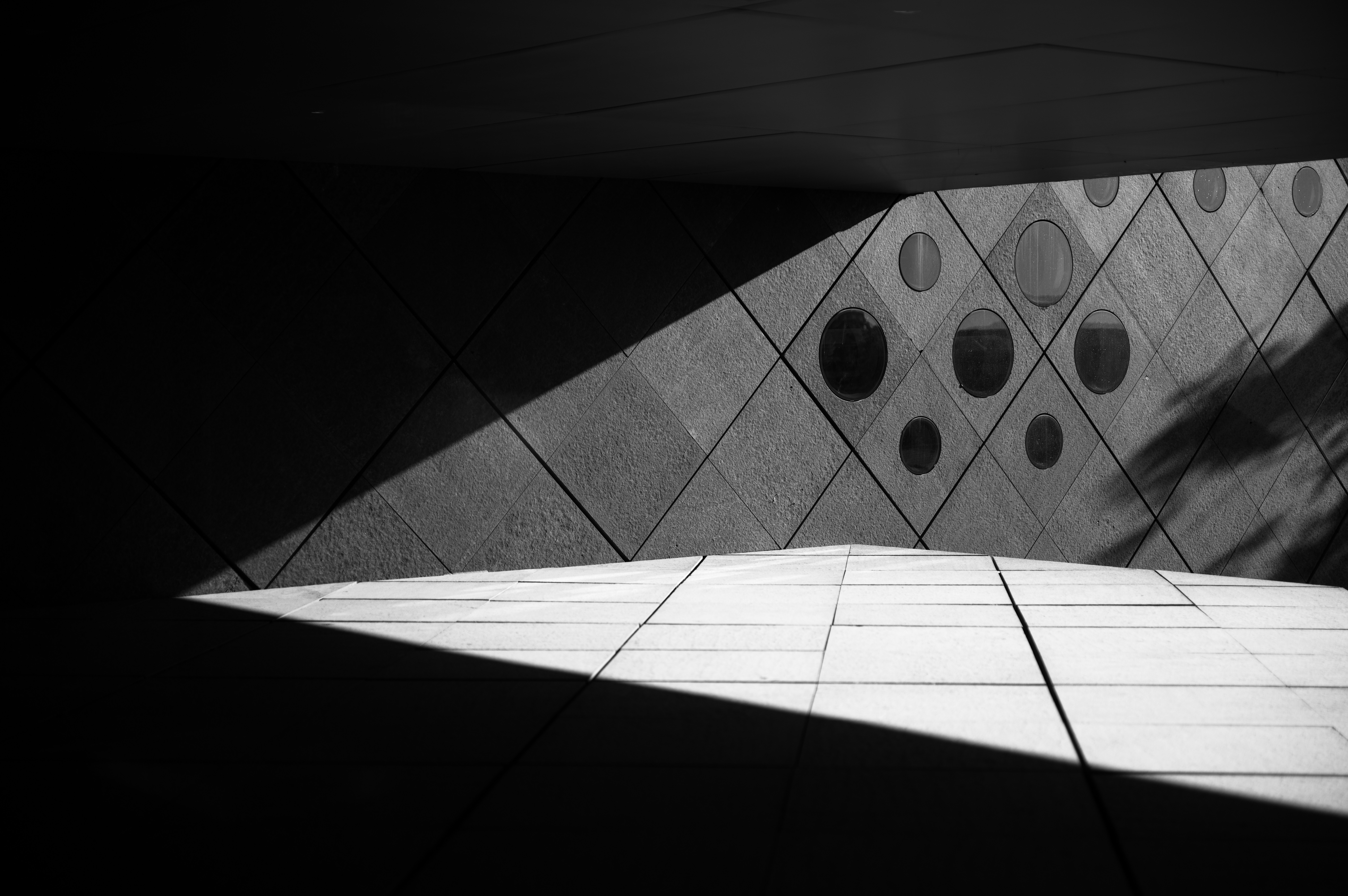 Shadowed Geometry: Sunlit Tile Triangle in an Urban Cut