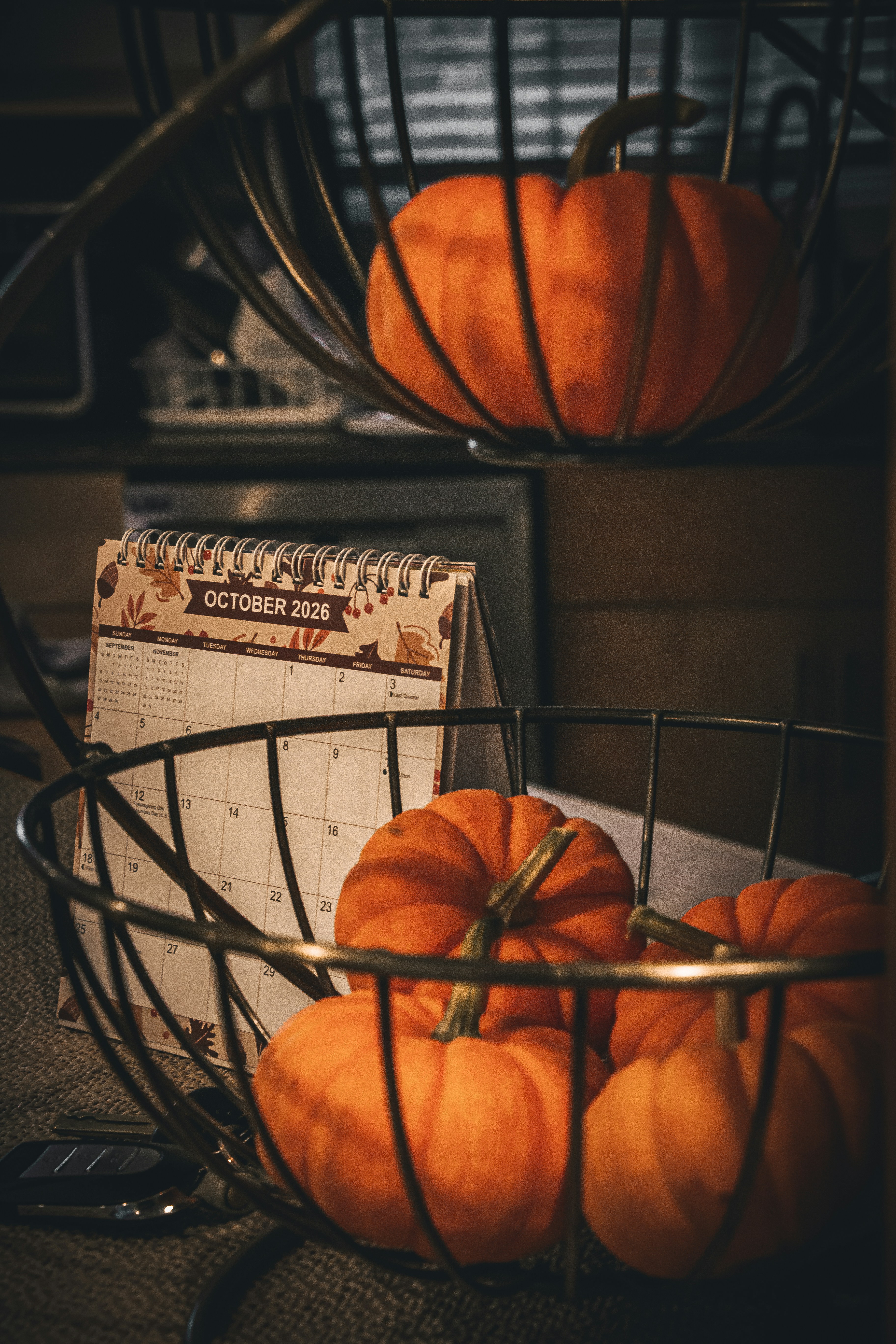 Basket of Autumn Quiet: Pumpkins and a Calendar in Soft Light