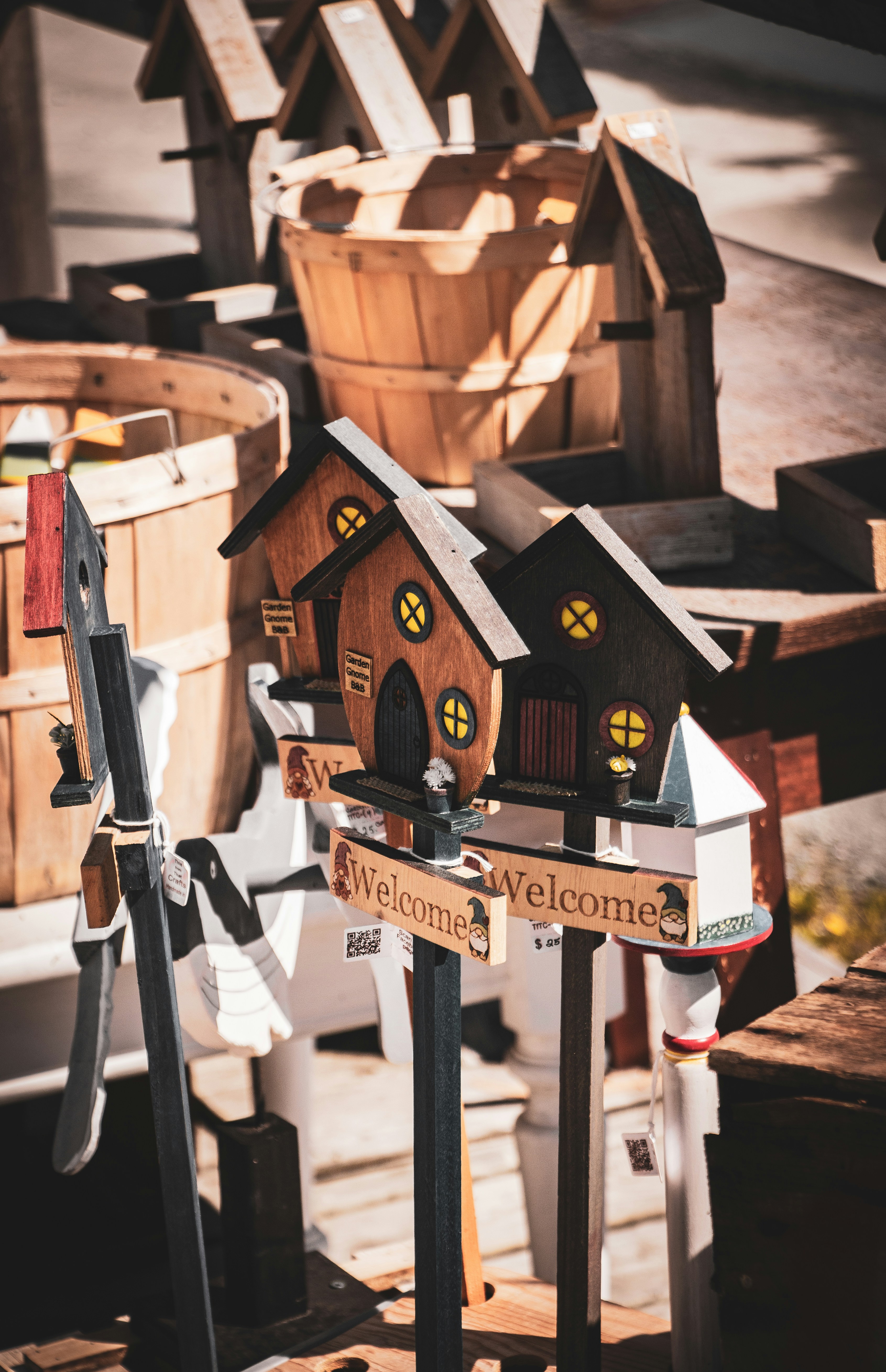 Miniature Village at Play: A Quirky Welcome Sign Among Wooden Carpets