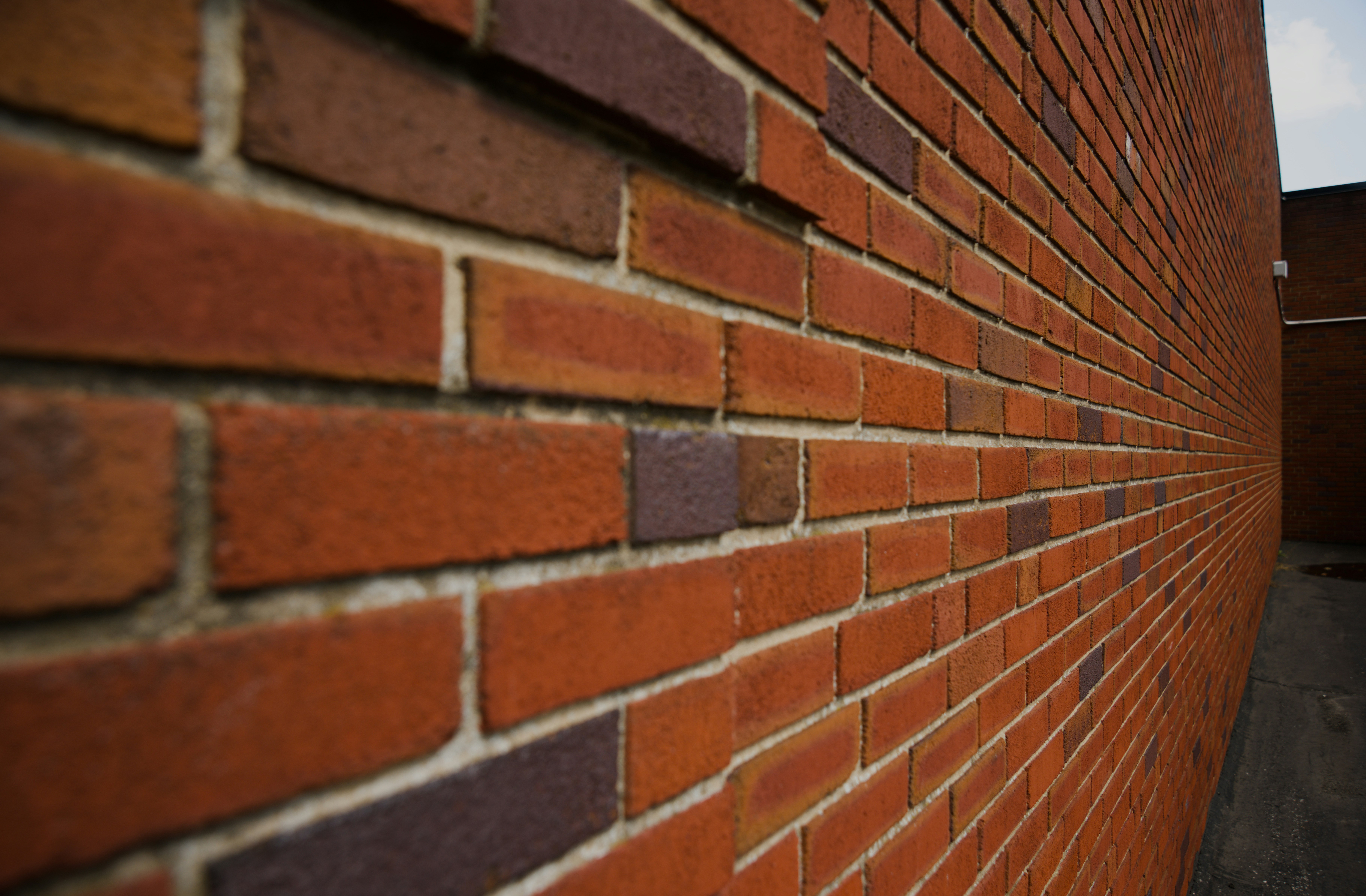Brick Corridor: Converging Lines and Texture