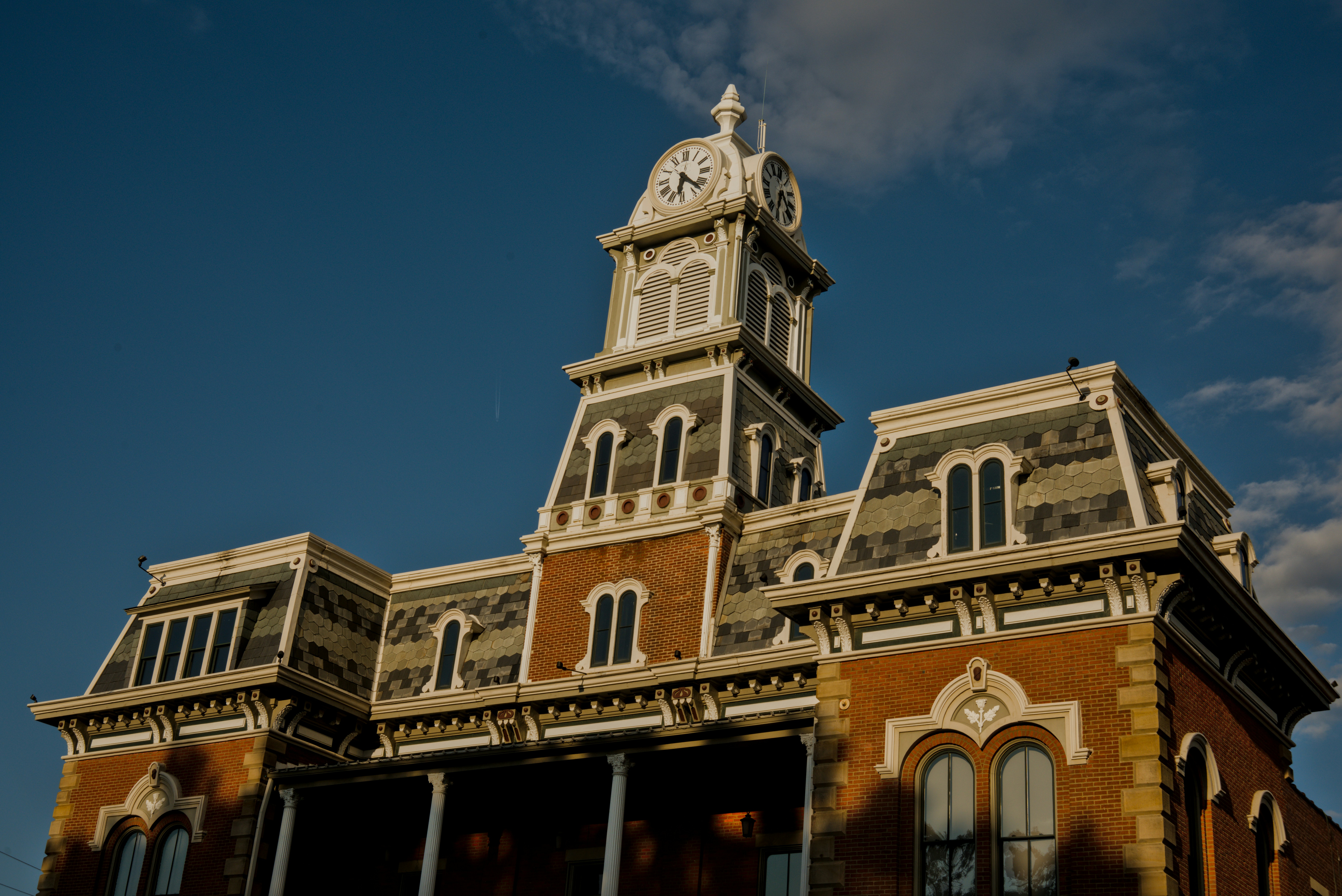 Clock Tower on a Brick-Crested Campus Building