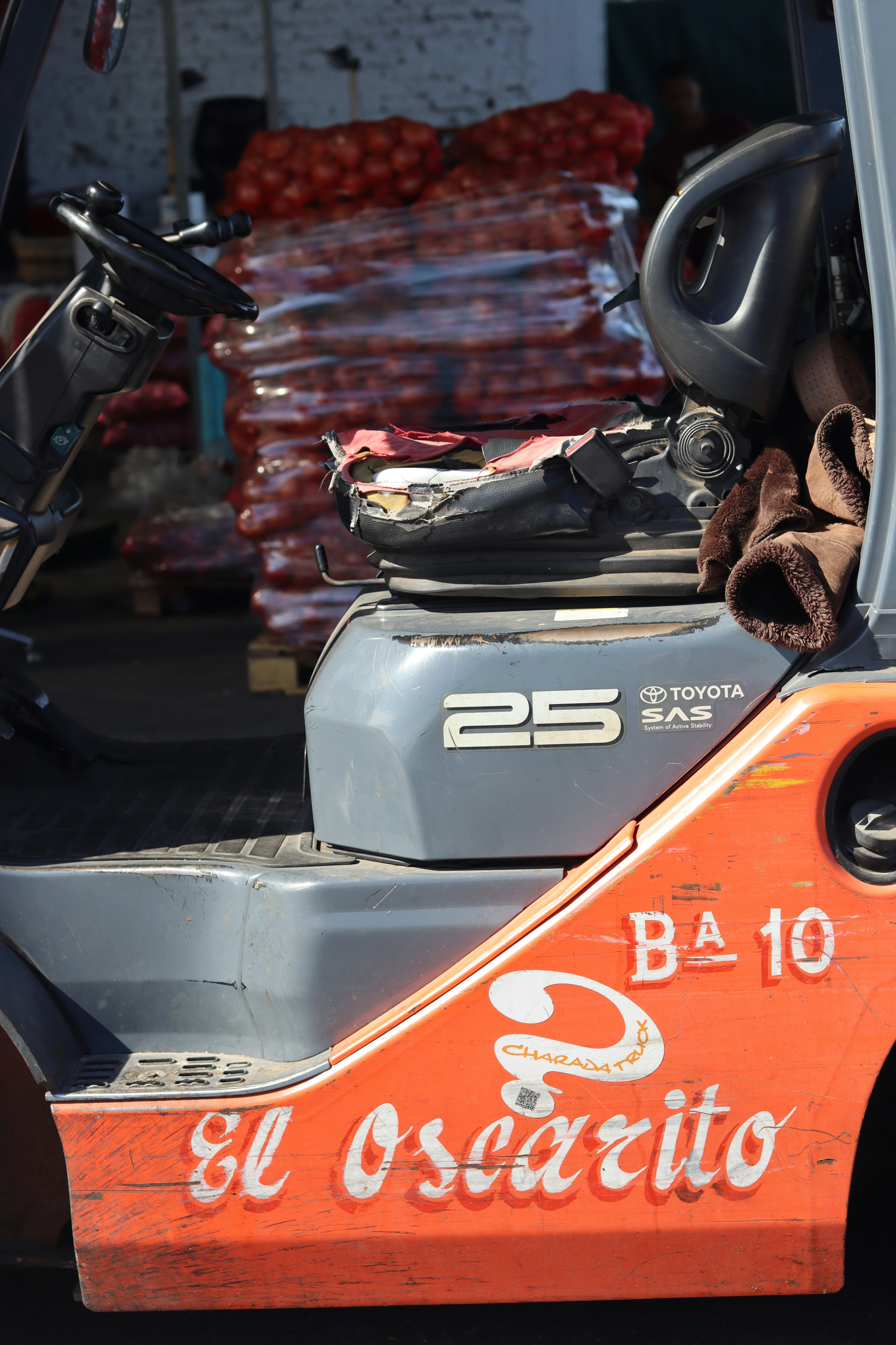 El Osadito: A Forklift's Quiet Moment by the Produce Yard