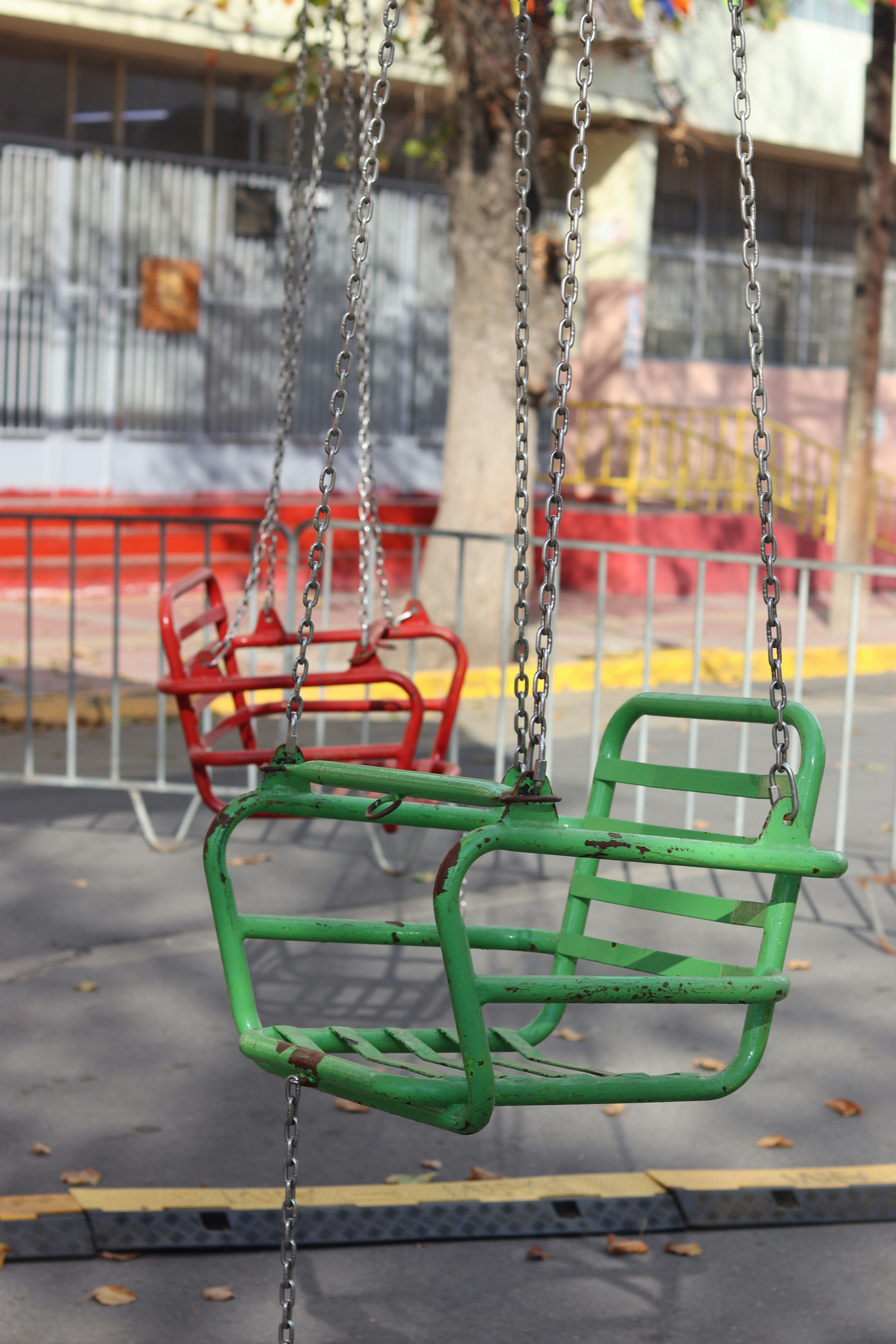 Green Swing in Focus: A Quiet Playground Moment