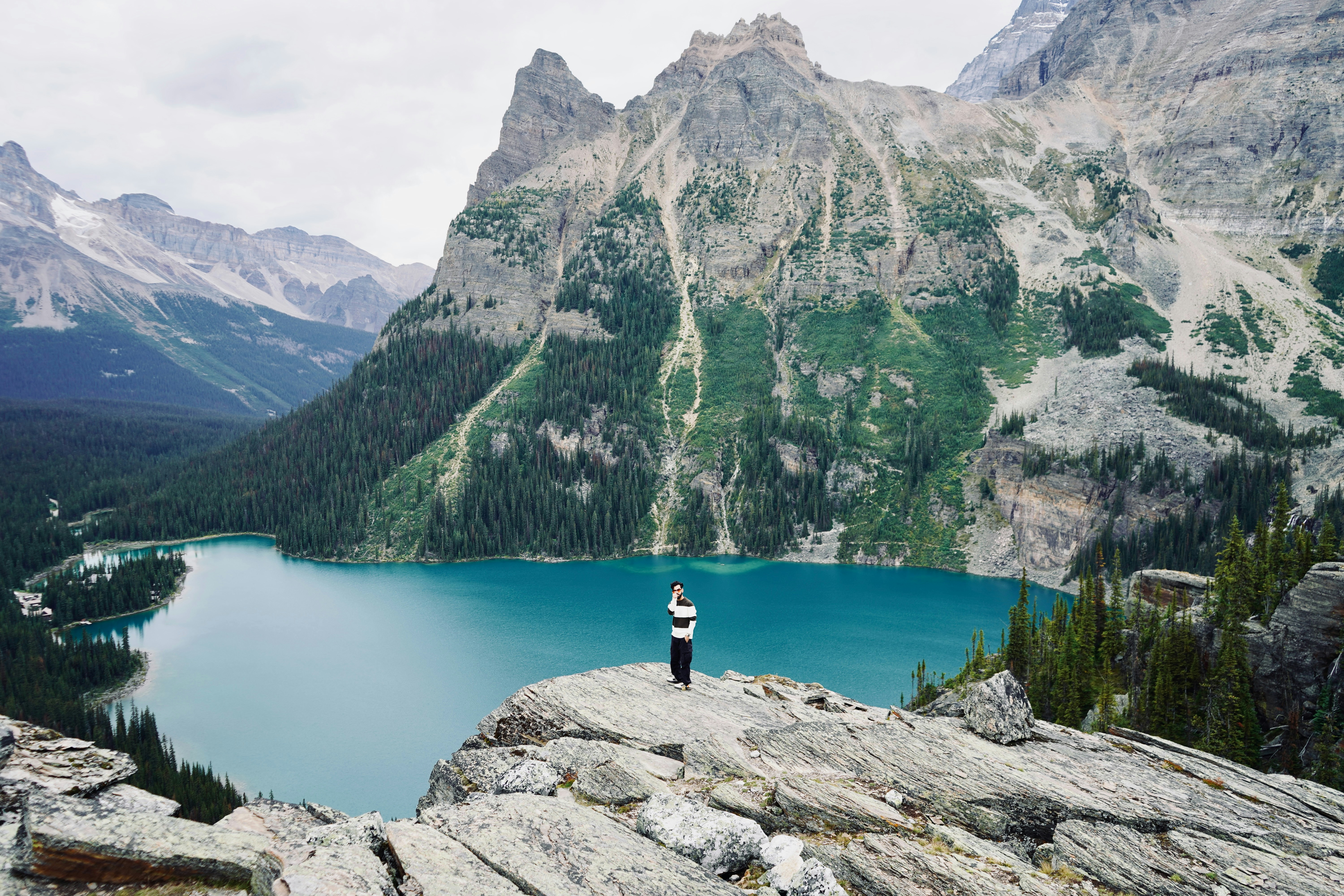 Emerald Lake Overlook: Solitary Wanderer on Alpine Rocks