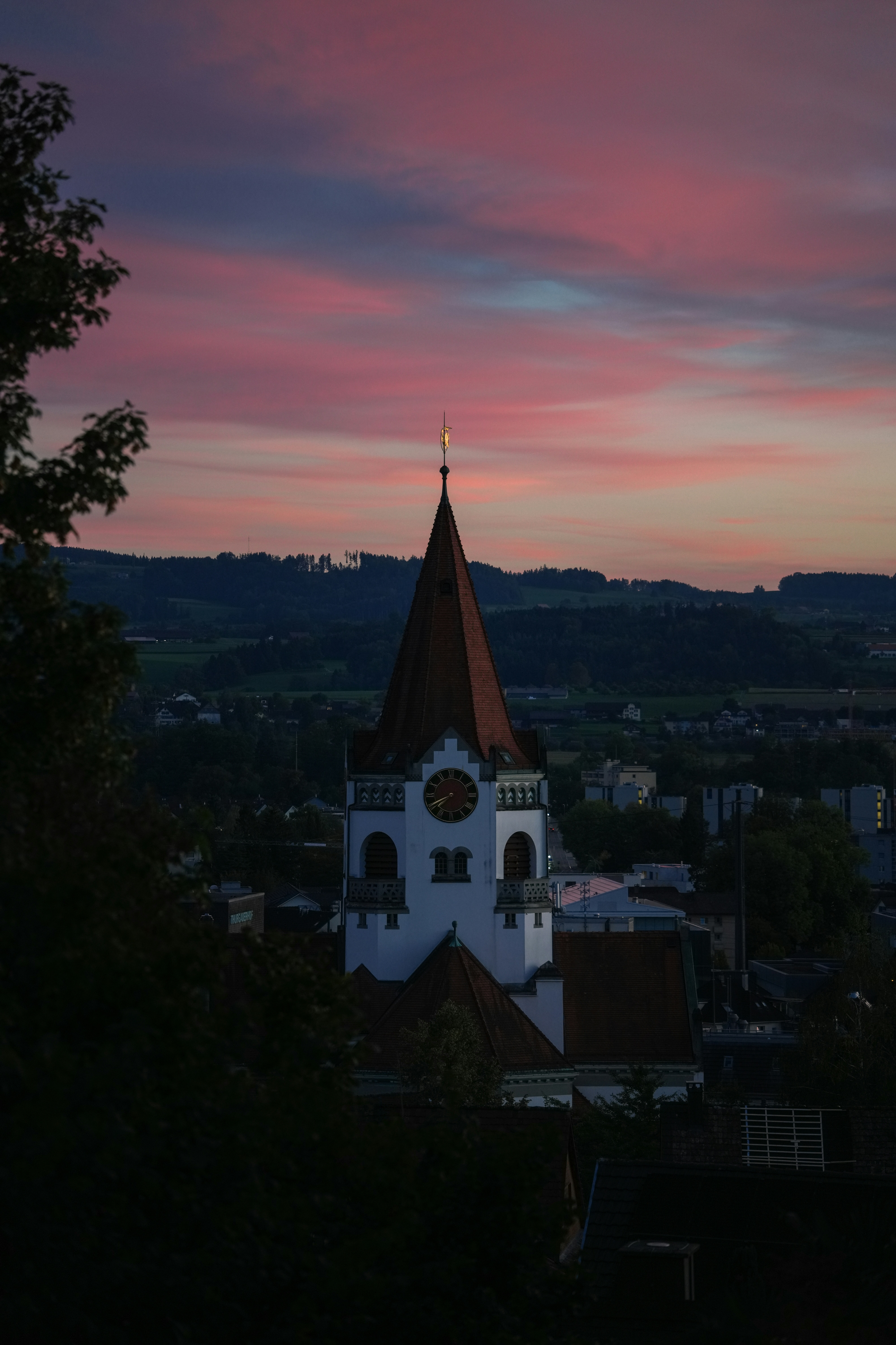 Steeple at Sunset: A Quiet Town Under a Pink Sky