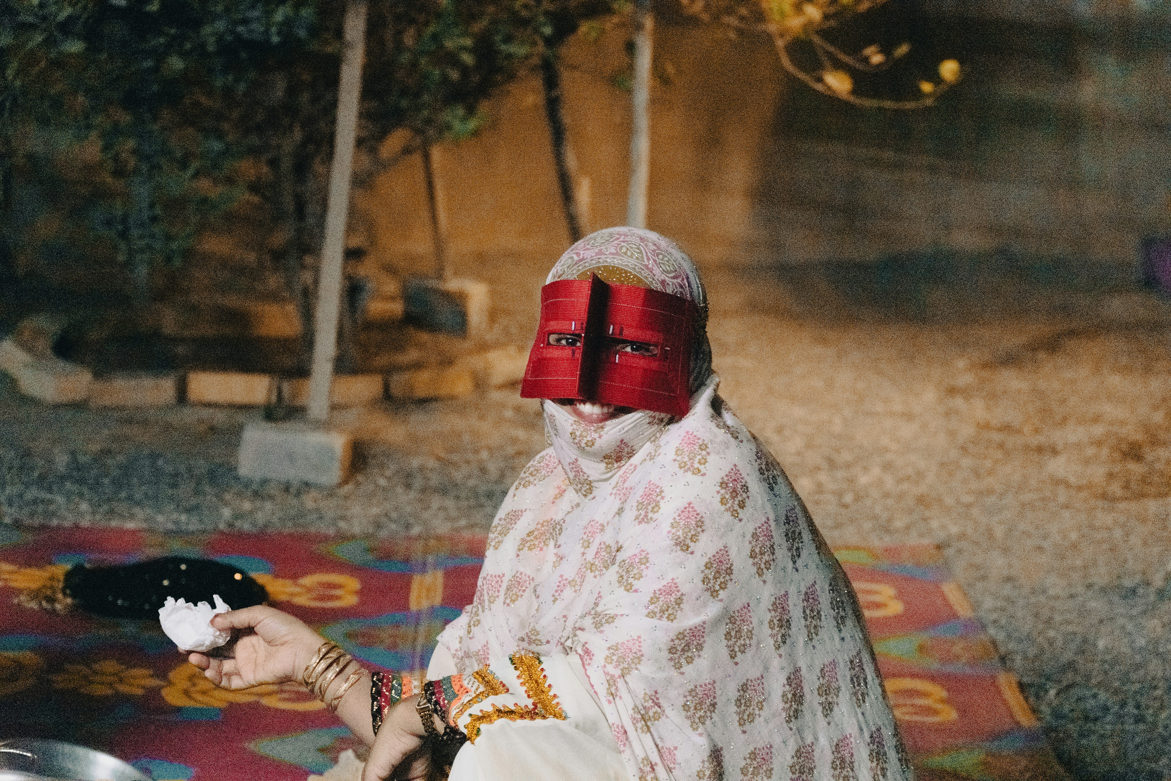 Masked Presence on a Quiet Caravan of Color