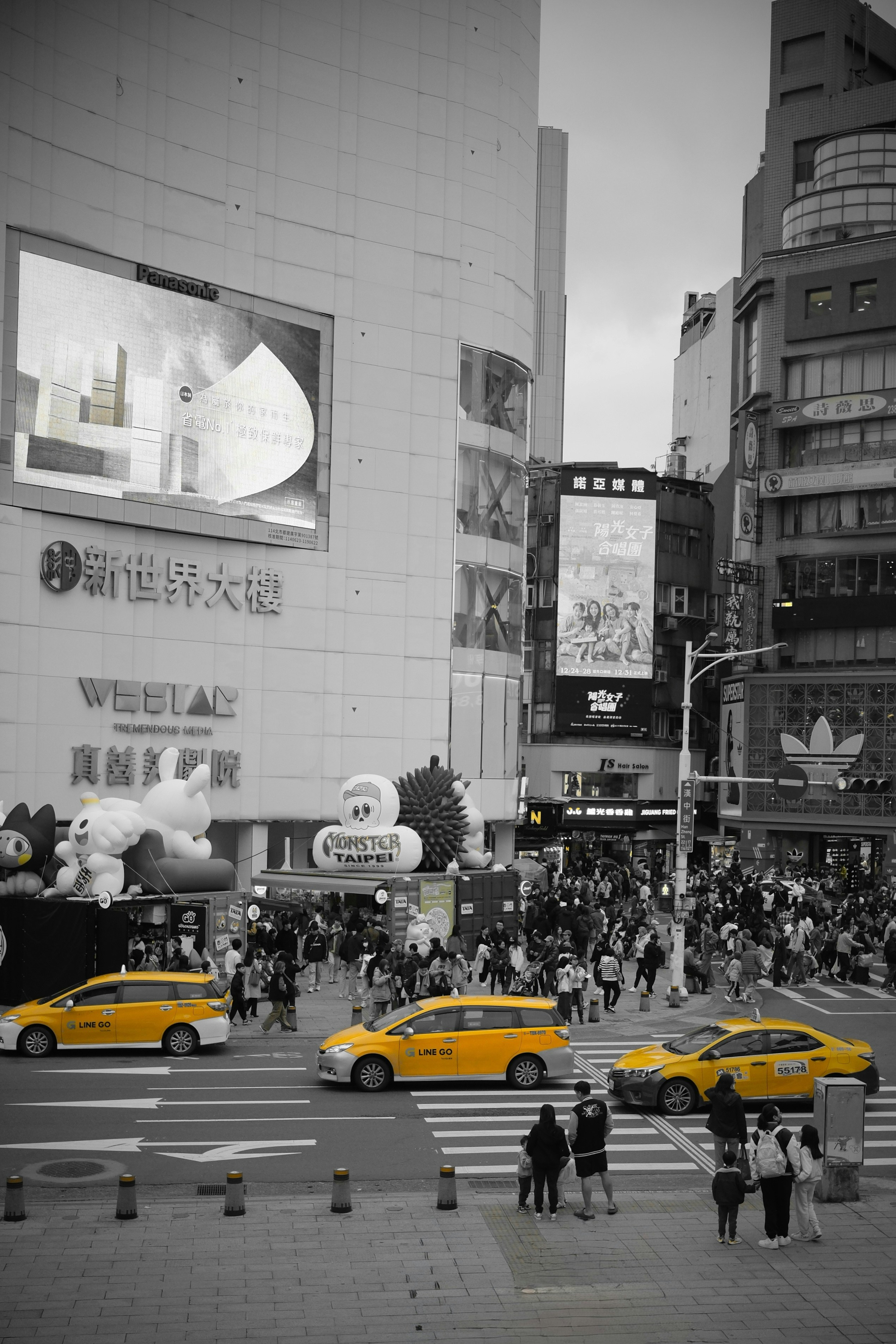 City Pulse: Street Level in Motion Under Neon Giants