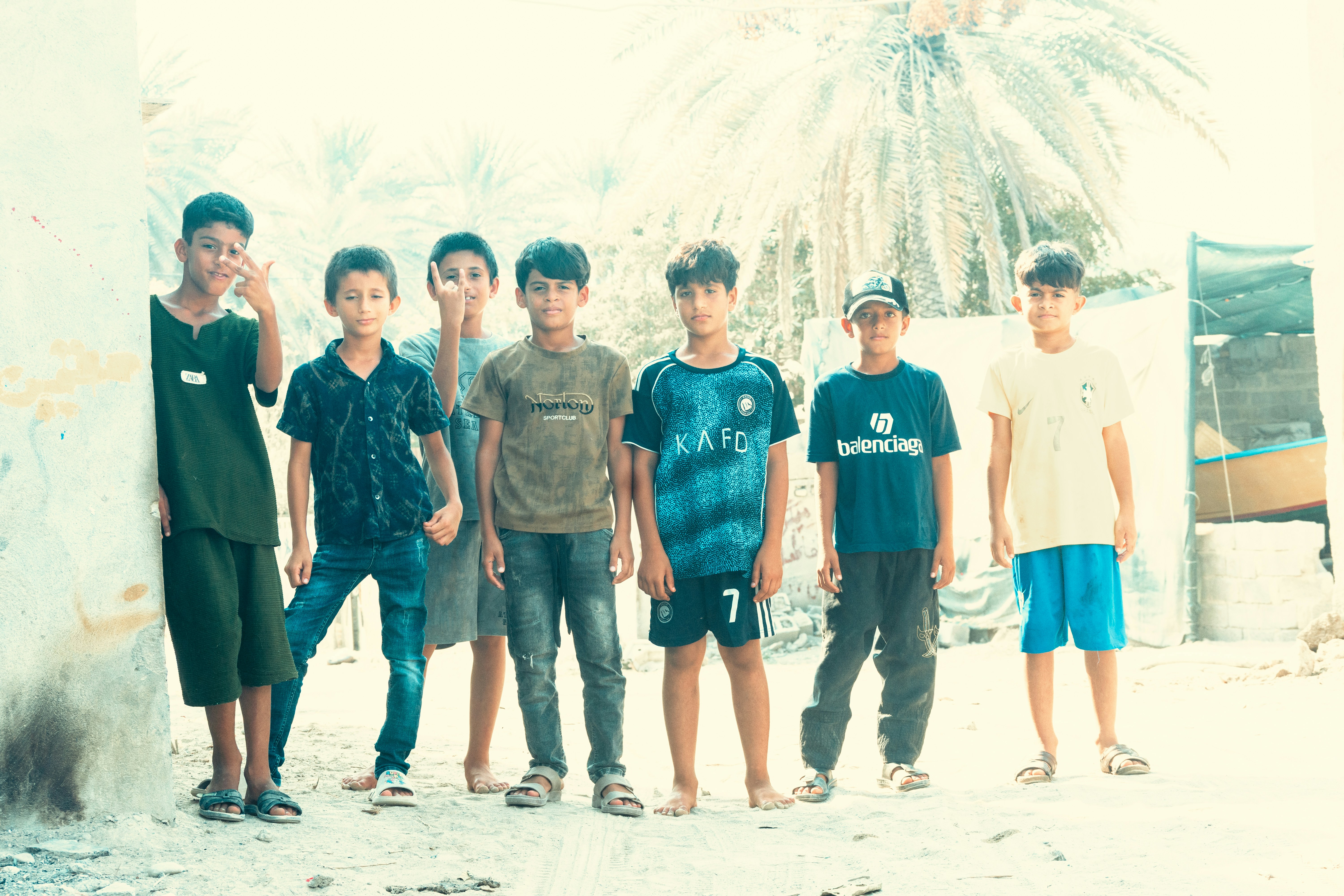 Line of Friends Under Palm Shade