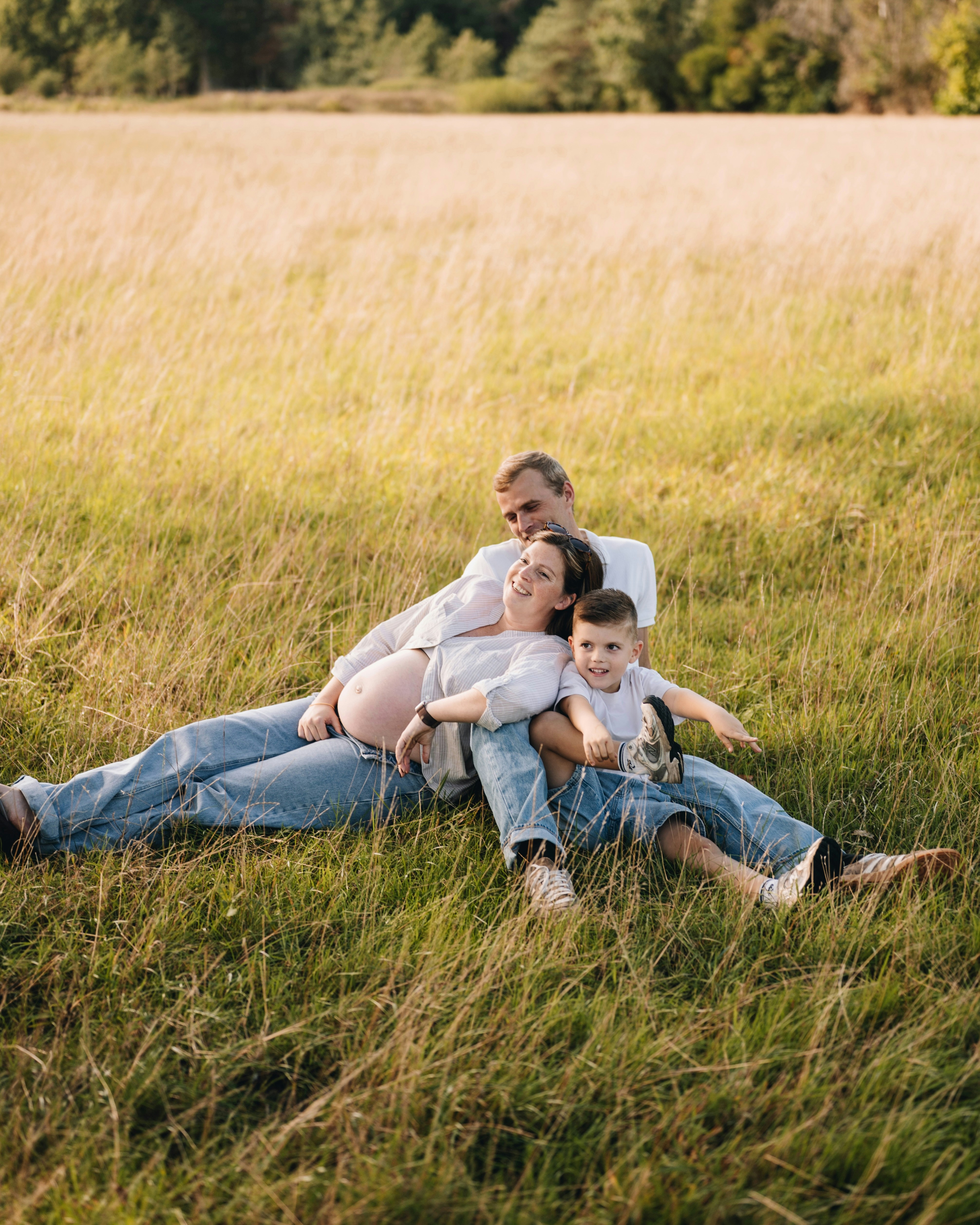 Sunlit Field, Shared Secret: A Family Moment in the Grasses
