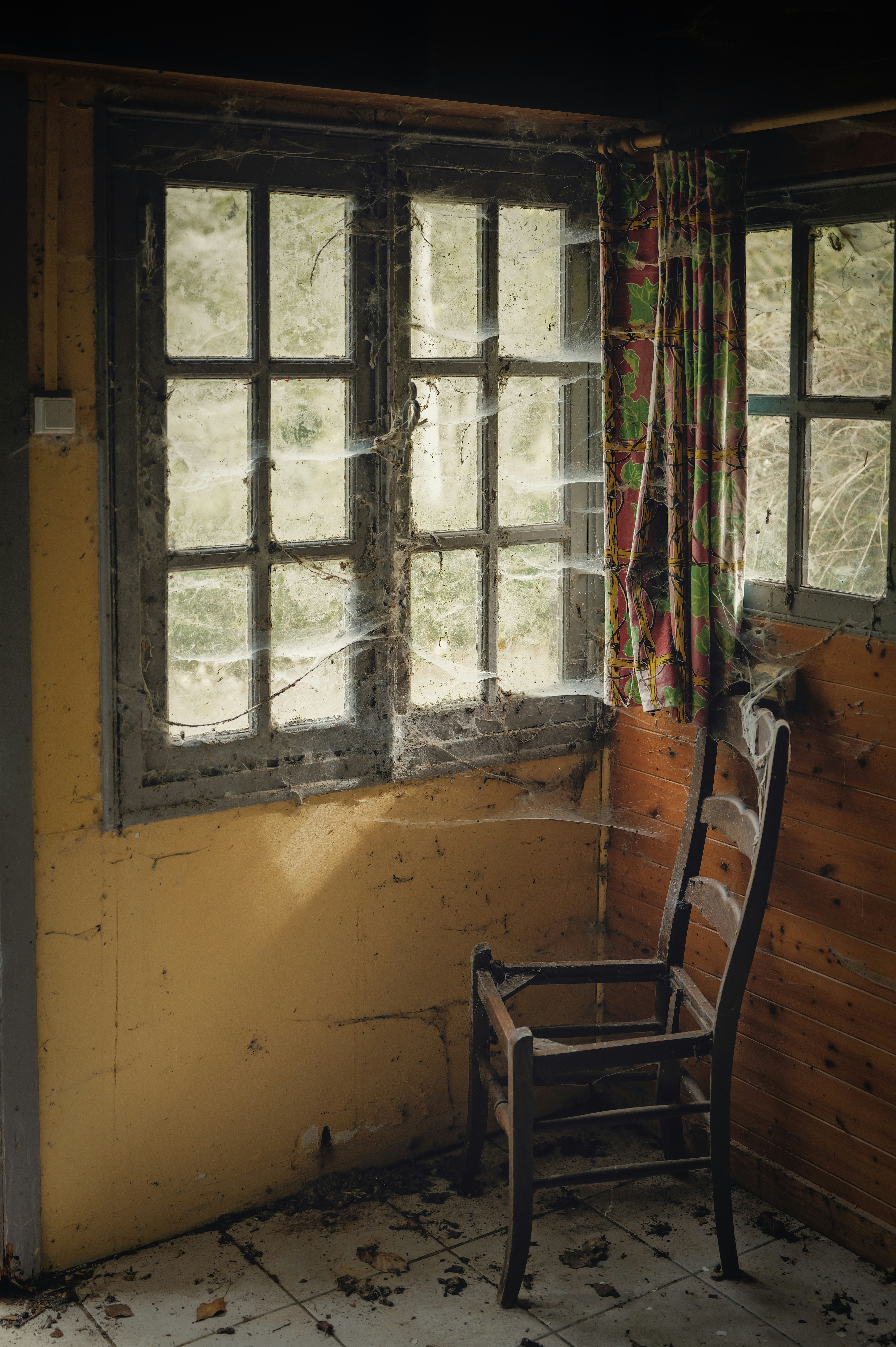 Dusty Window Light and Silent Chair in an Abandoned Room