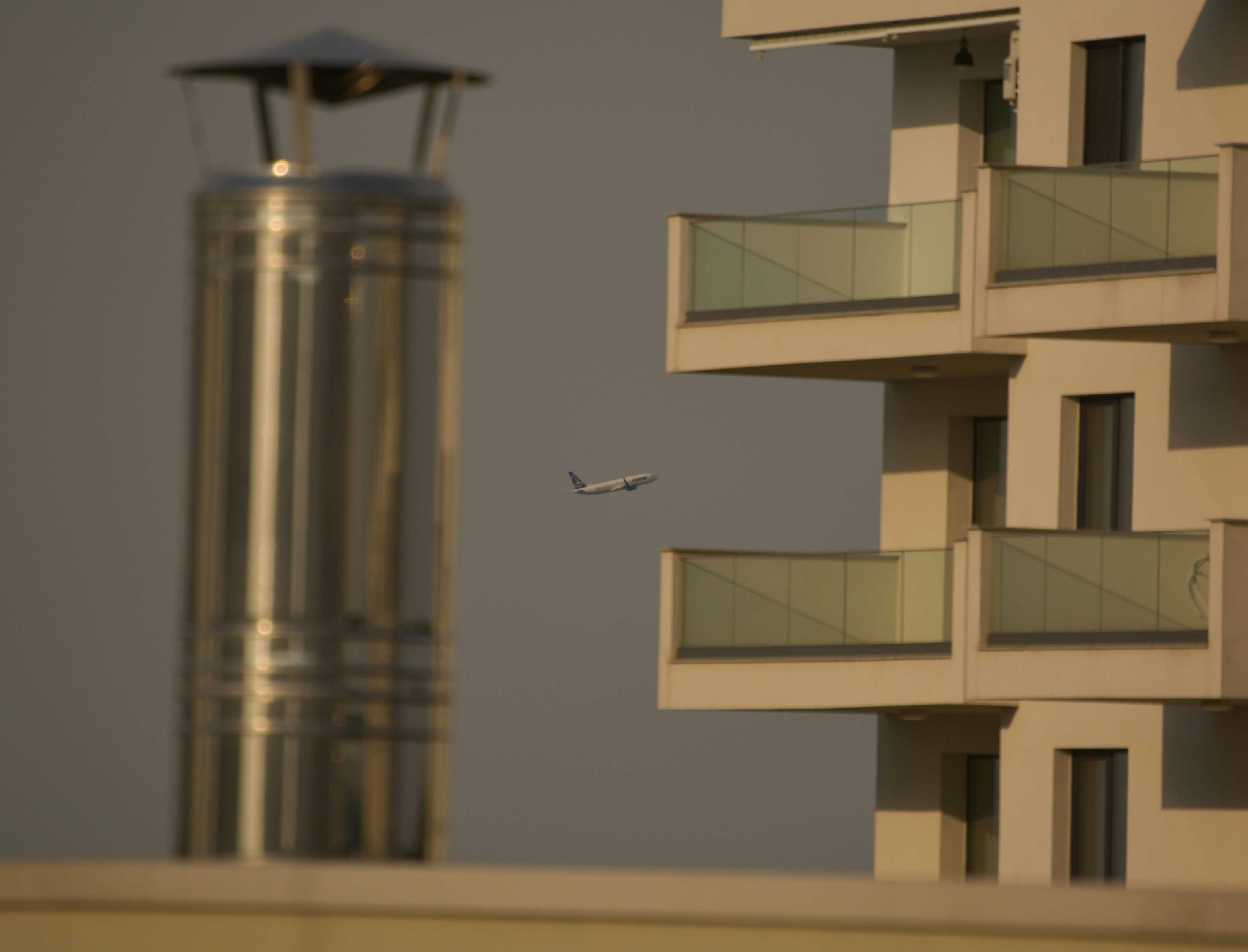 Concrete Flight: A Jet Trace Between Balconies
