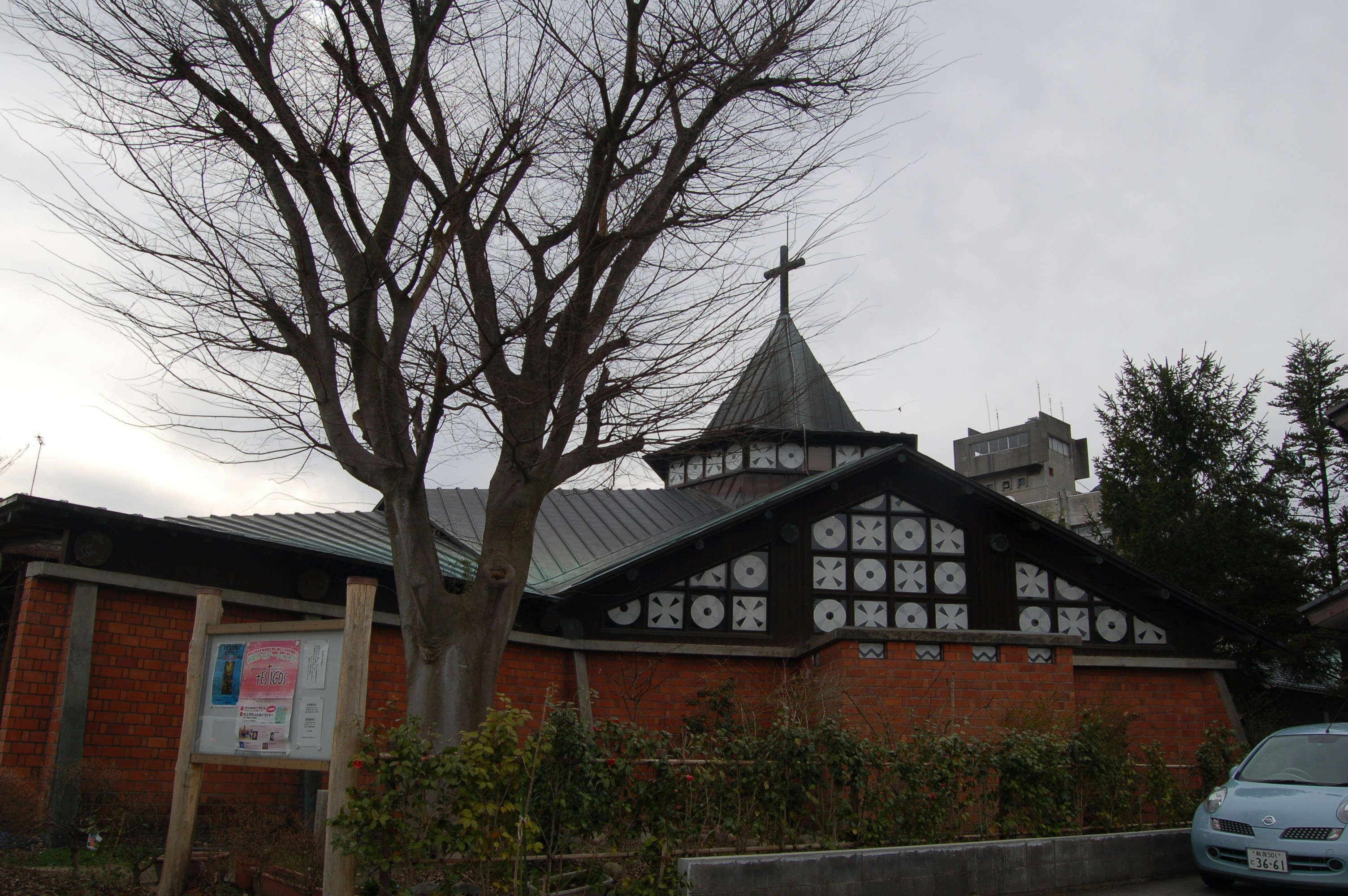 Brick Chapel Under a Leafless Tree with a Crossover Dune of Windows