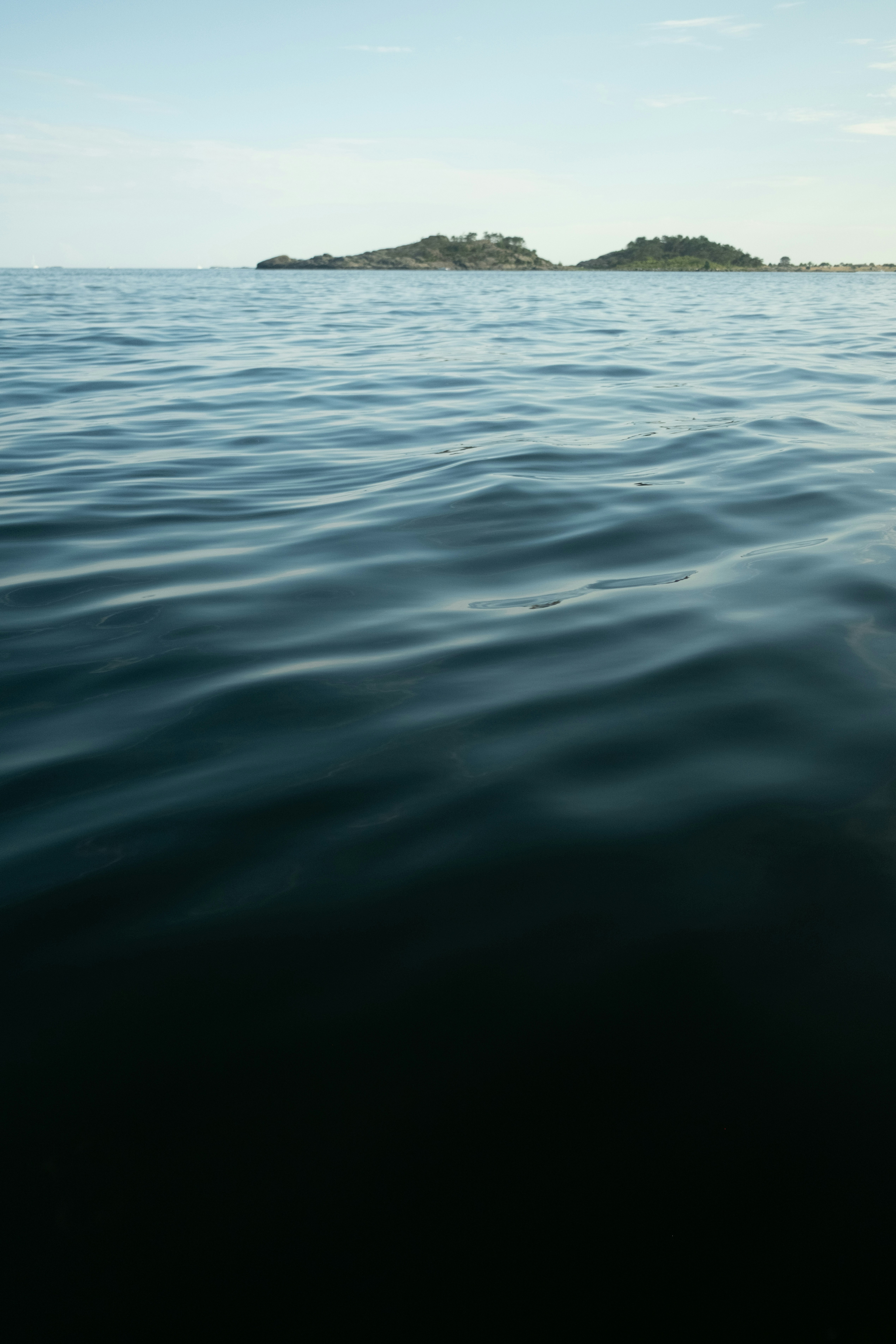 Horizon Quiet: Distant Islands on a Glassy Sea