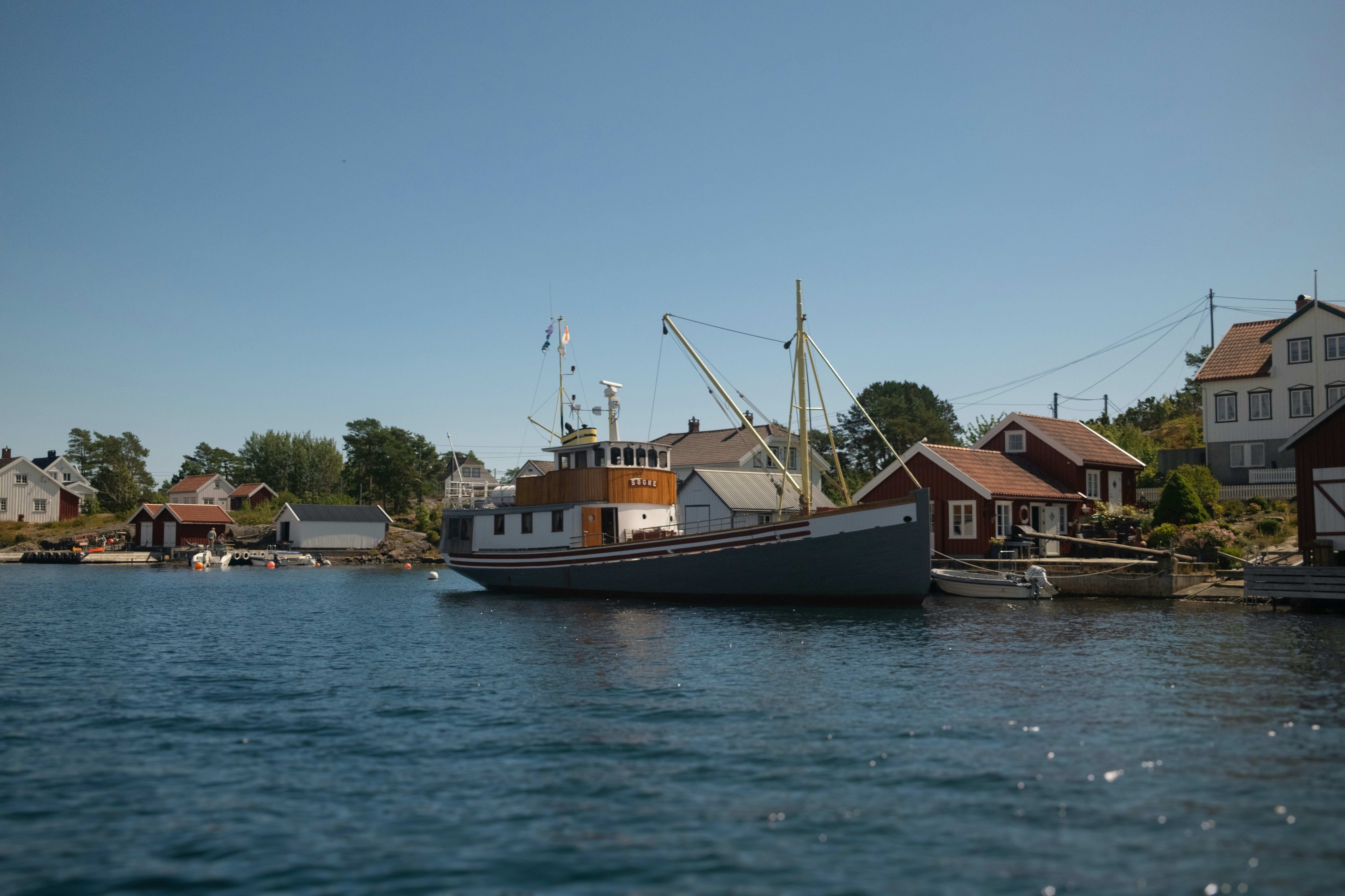 Harbor Vessel Docked in Quiet Coastal Village