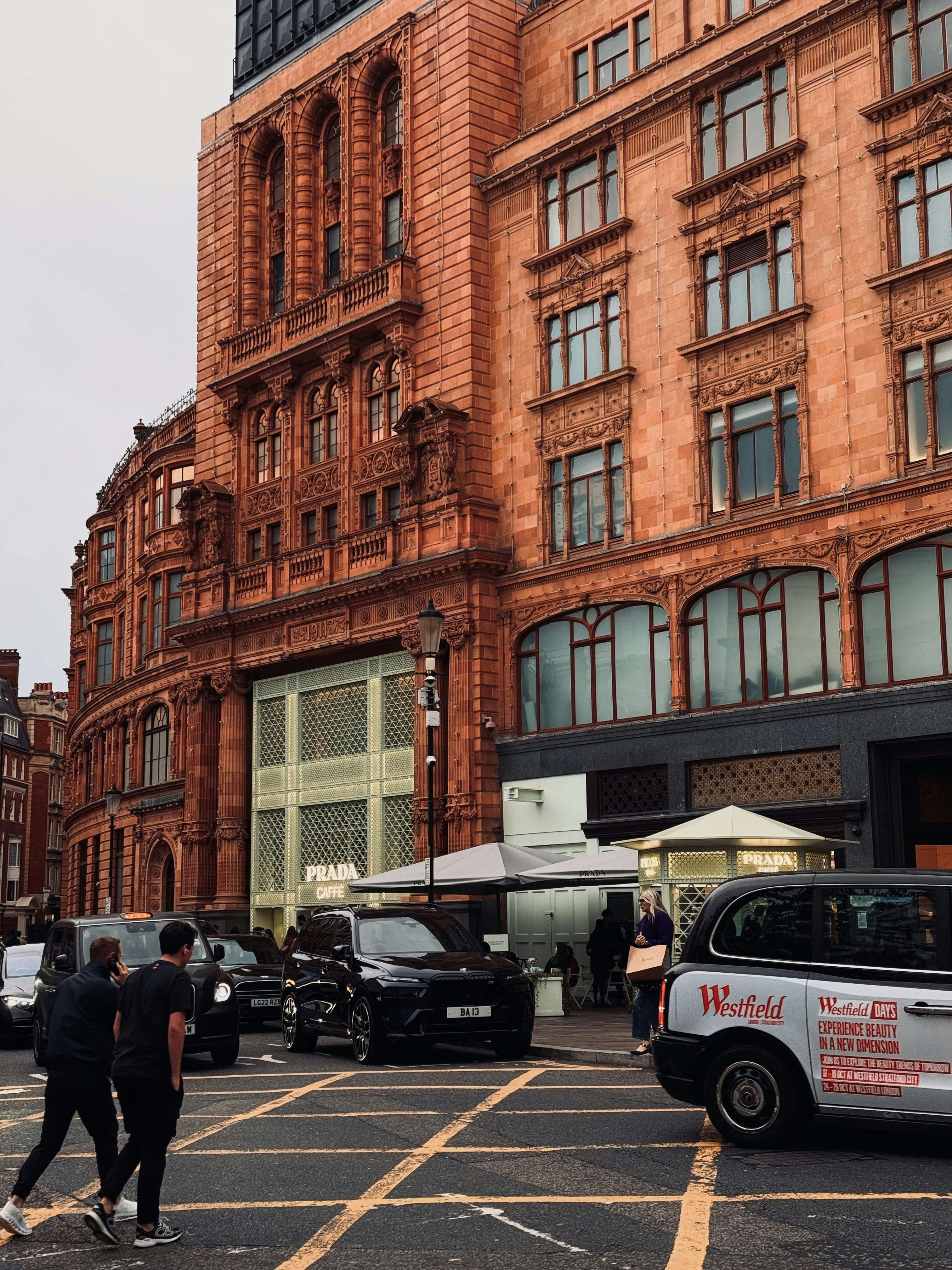 Red Brick Facade, Busy Street, and Prada Window Scene
