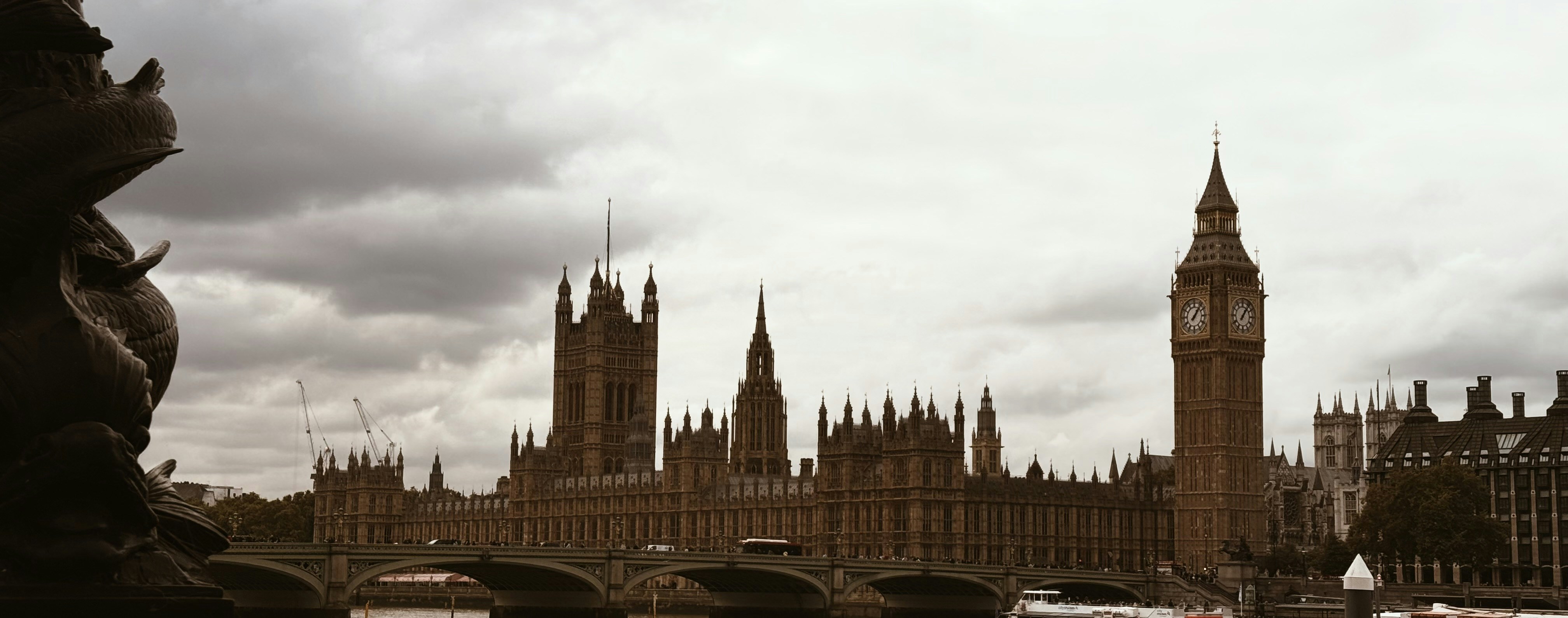 London's Gothic silhouette: a bridge and Big Ben under moody skies