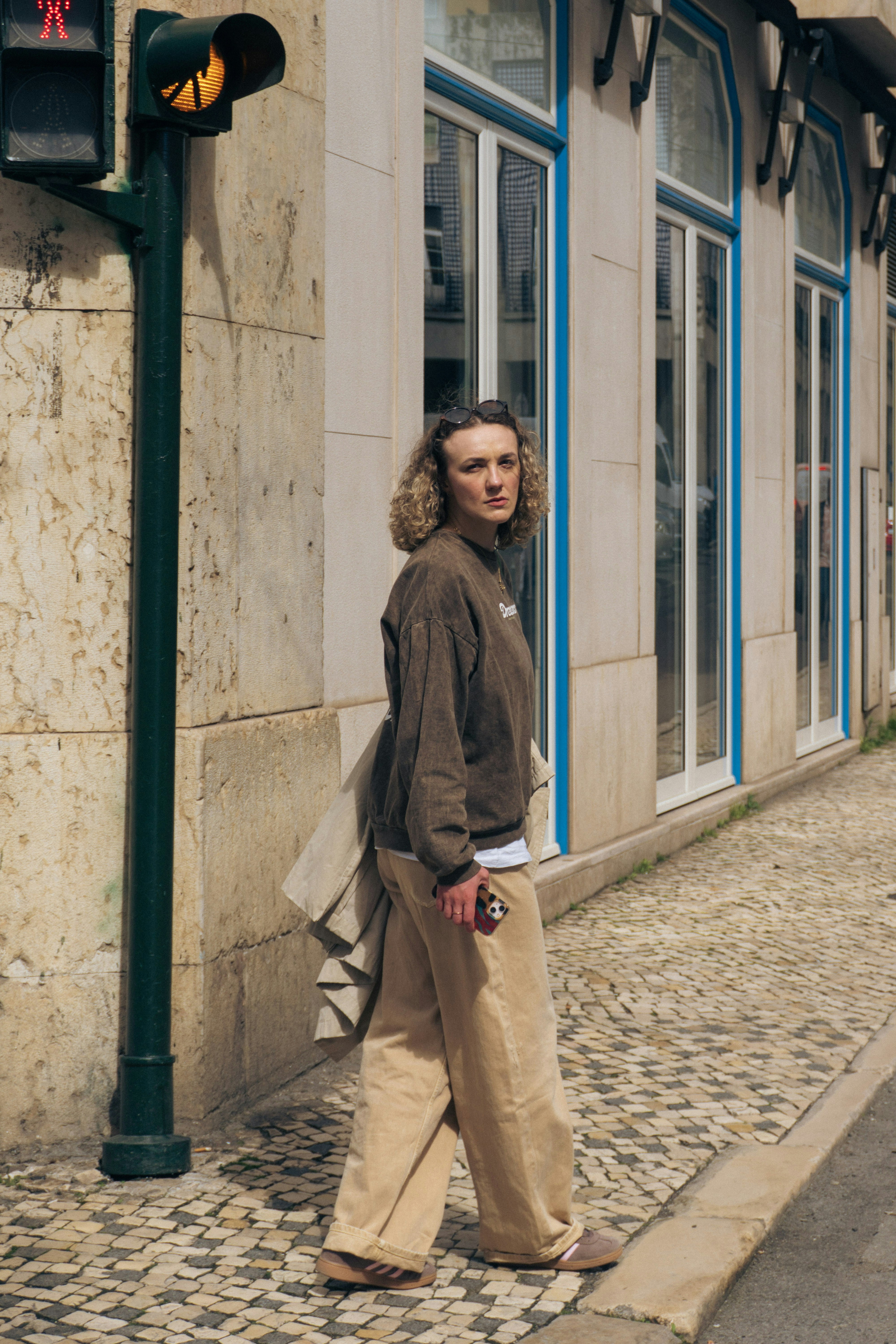 Crosswalk Quiet: A Street Portrait with Soft Urban Light