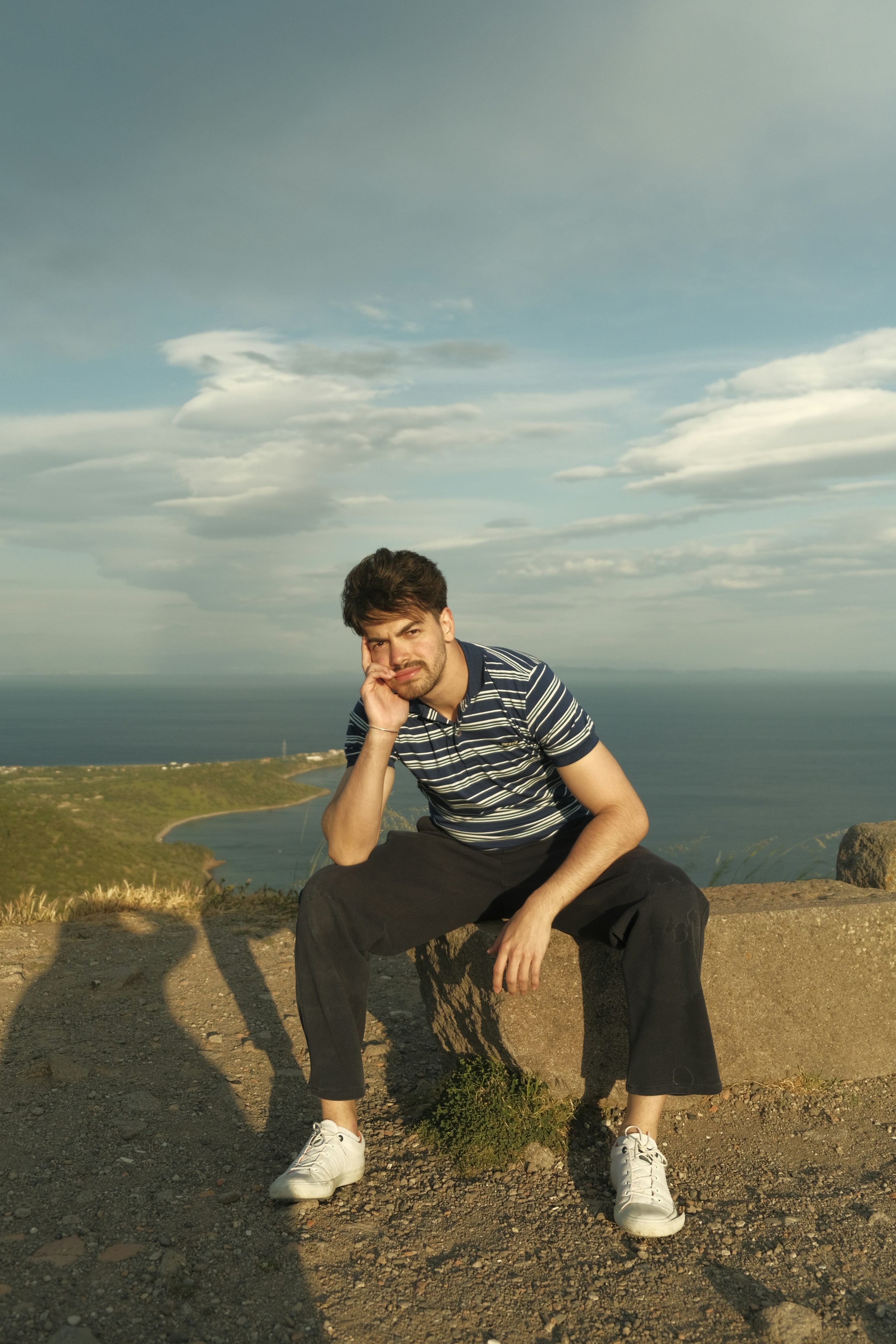 Seaside sitter: a thoughtful moment atop the clifftop