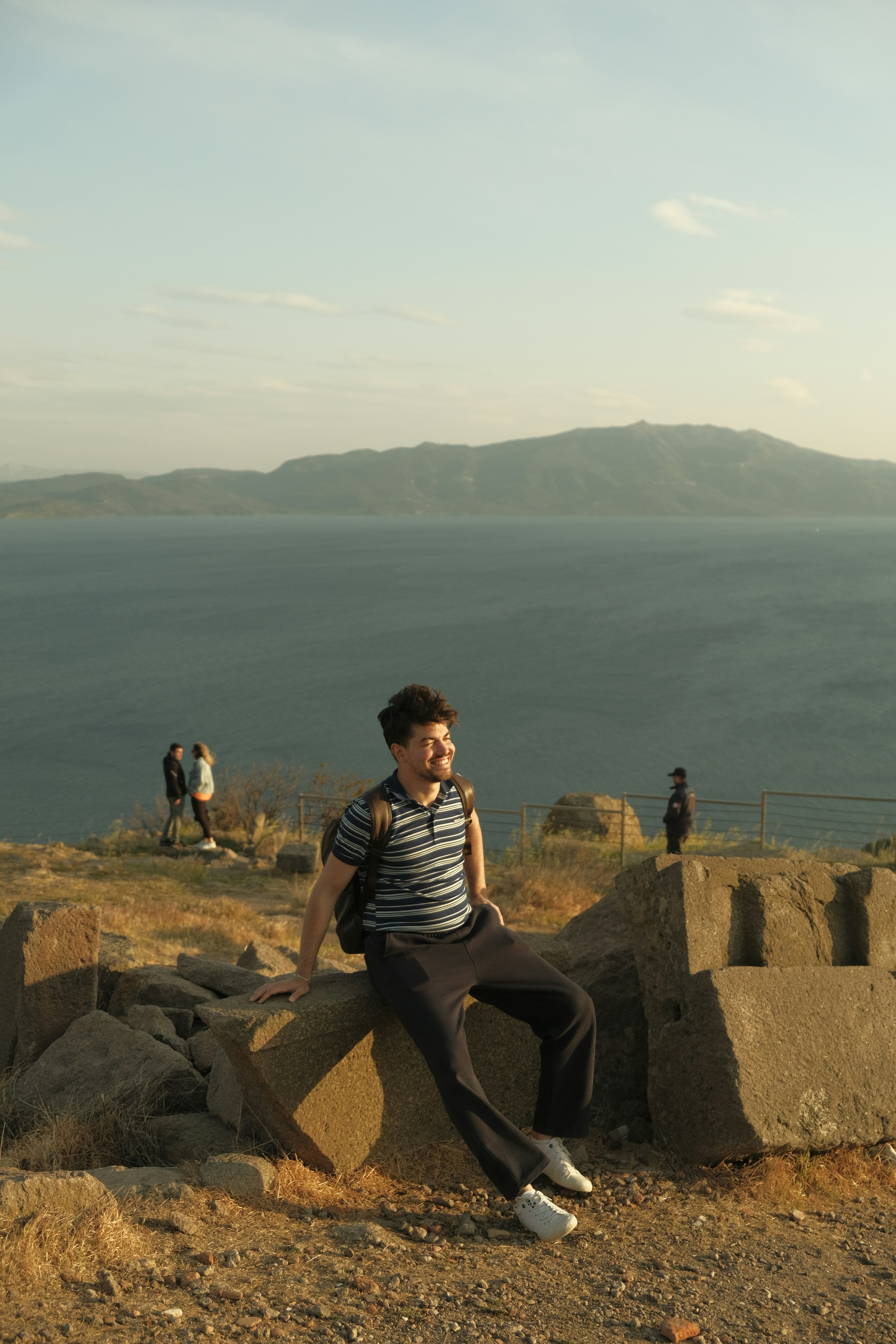 Casual Cliffside Pause Above the Sea
