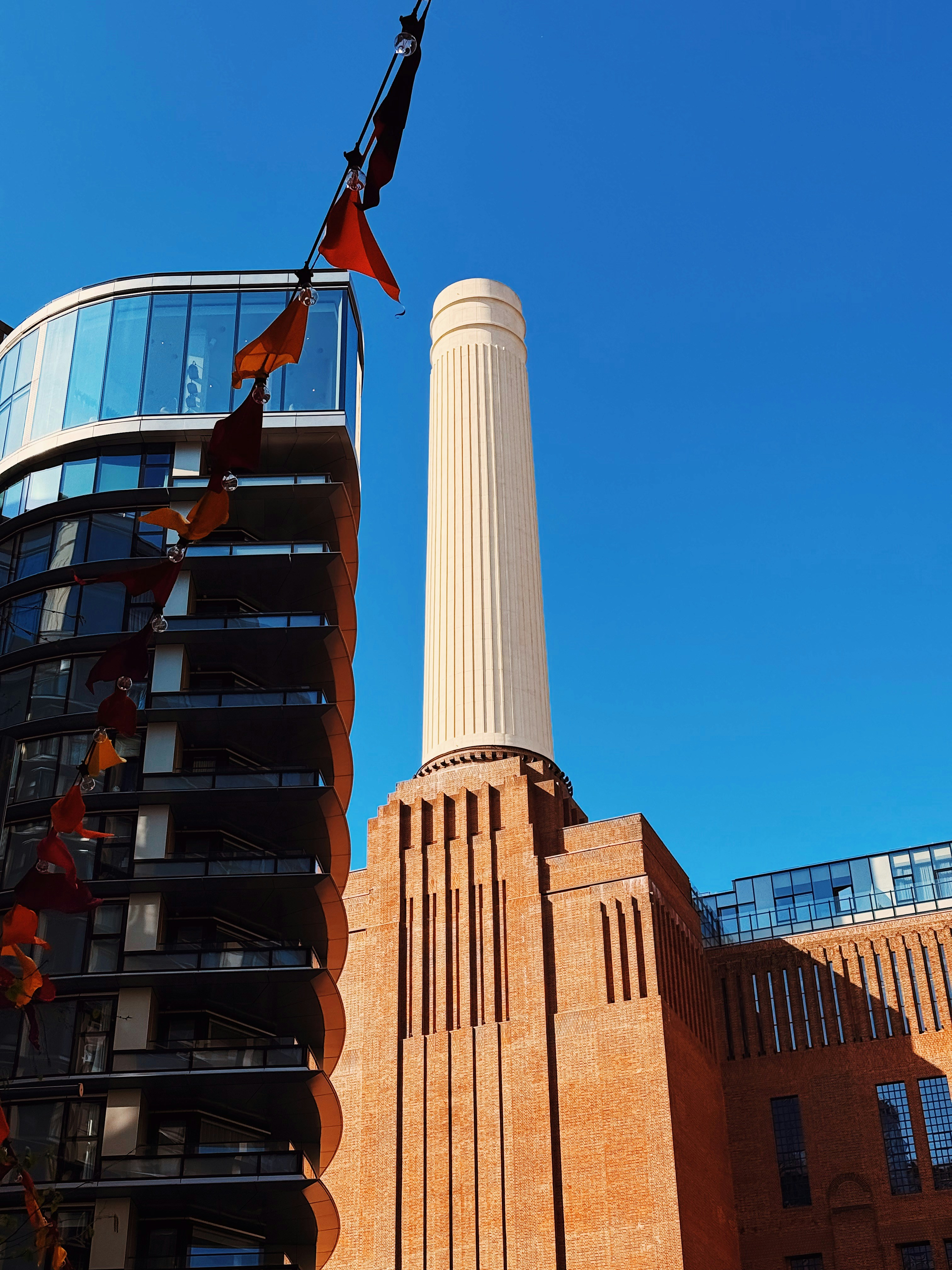 Brick Chimera and Glass Spine: A City Tower Reaches for the Sky