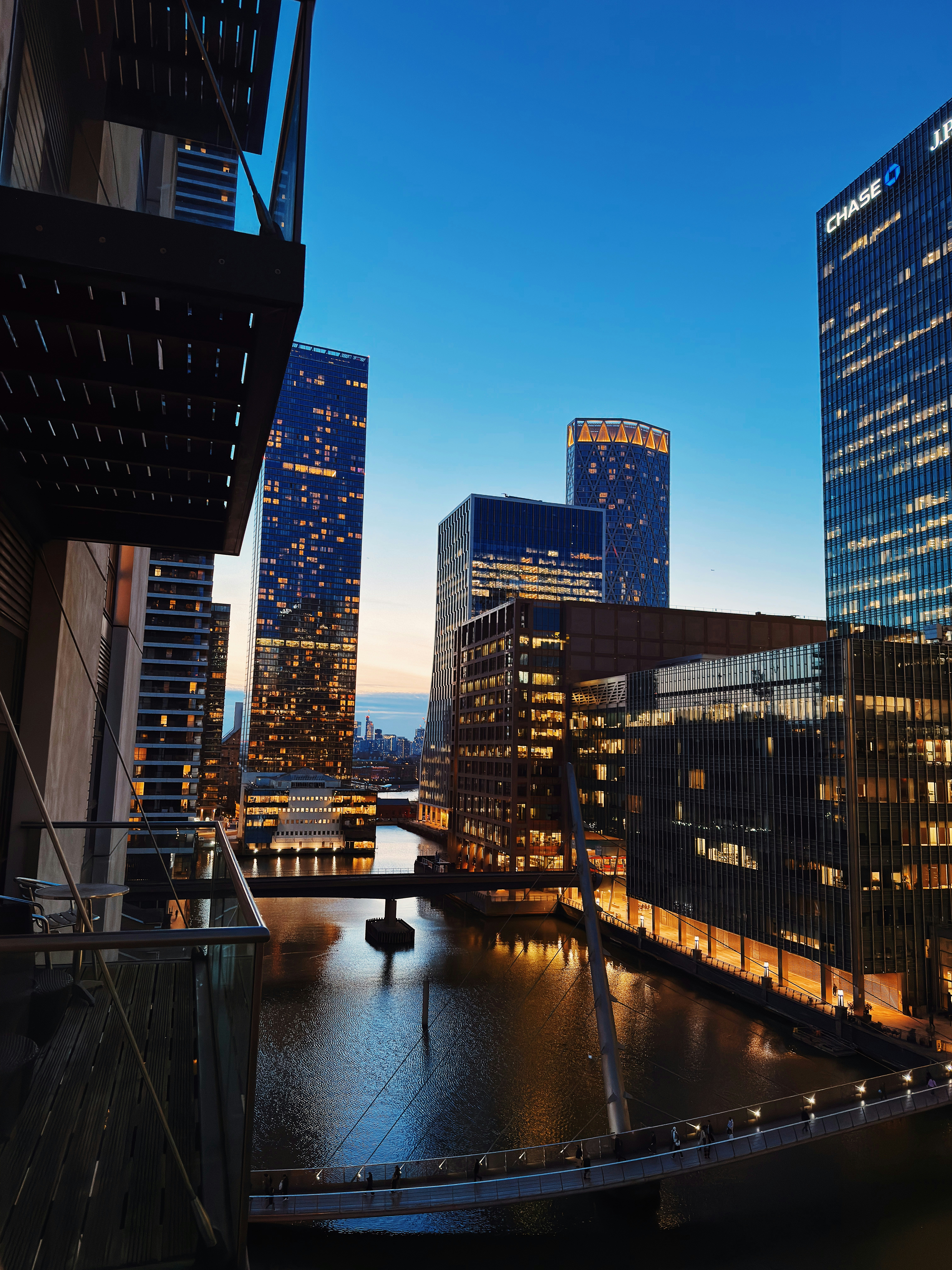 Urban Riverlight: Skyscrapers Framing a Glowing Corridor